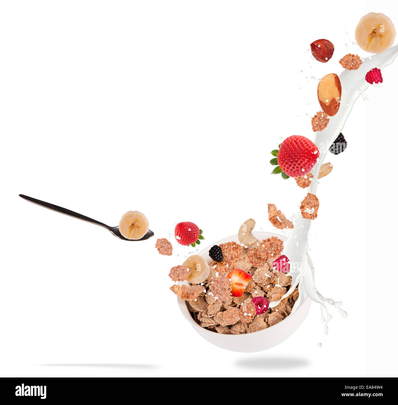 Healthy bowl with flying cereals and fruit, isolated on white ...