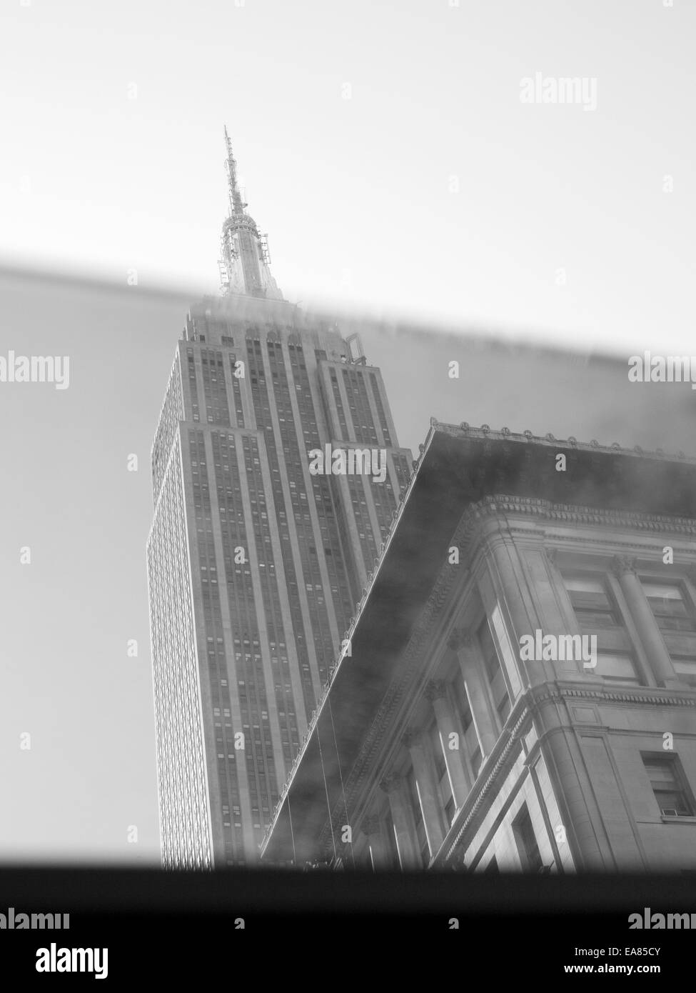 Empire state building through window Black and White Stock Photos ...