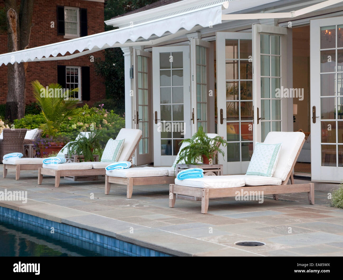 Chaise Lounges poolside Stock Photo - Alamy