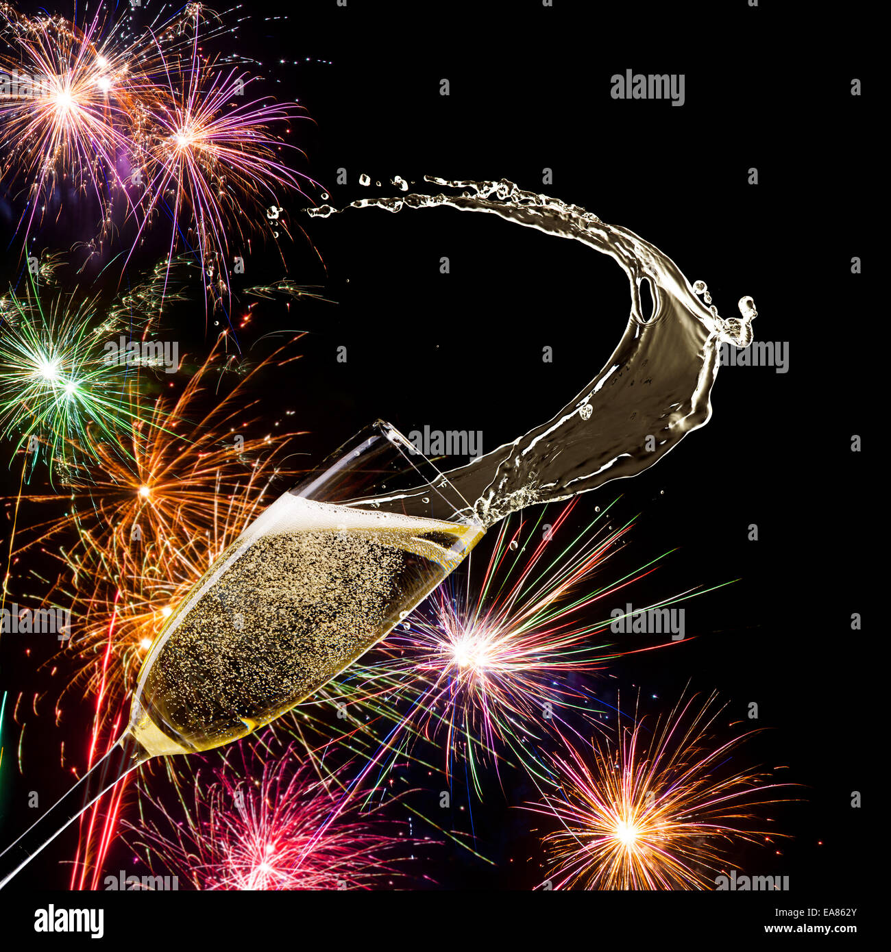 Champagne glass with fireworks on background Stock Photo - Alamy