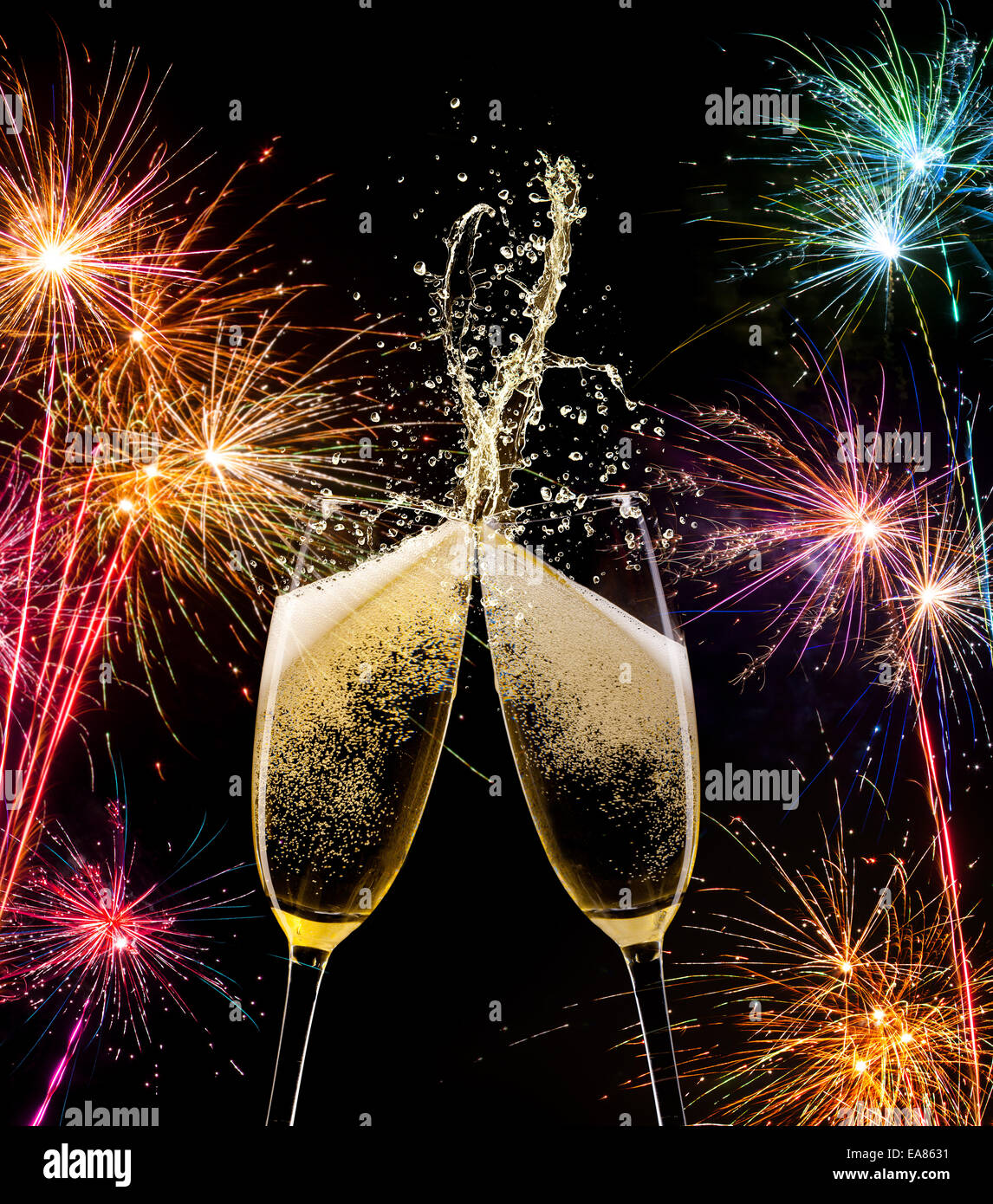 Champagne glasses with fireworks on background Stock Photo - Alamy