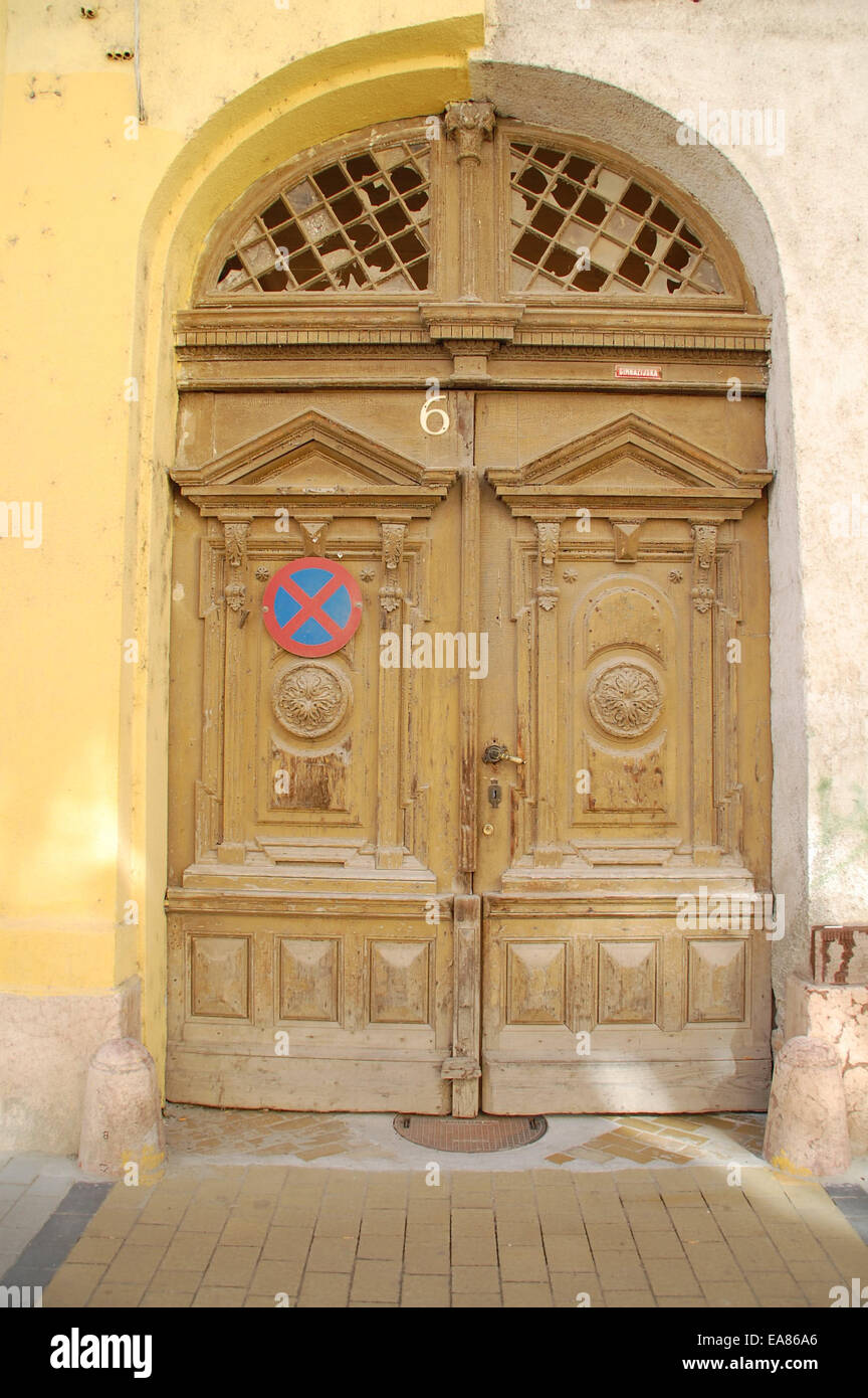 Very old gate on one of the buildings in the city Stock Photo - Alamy