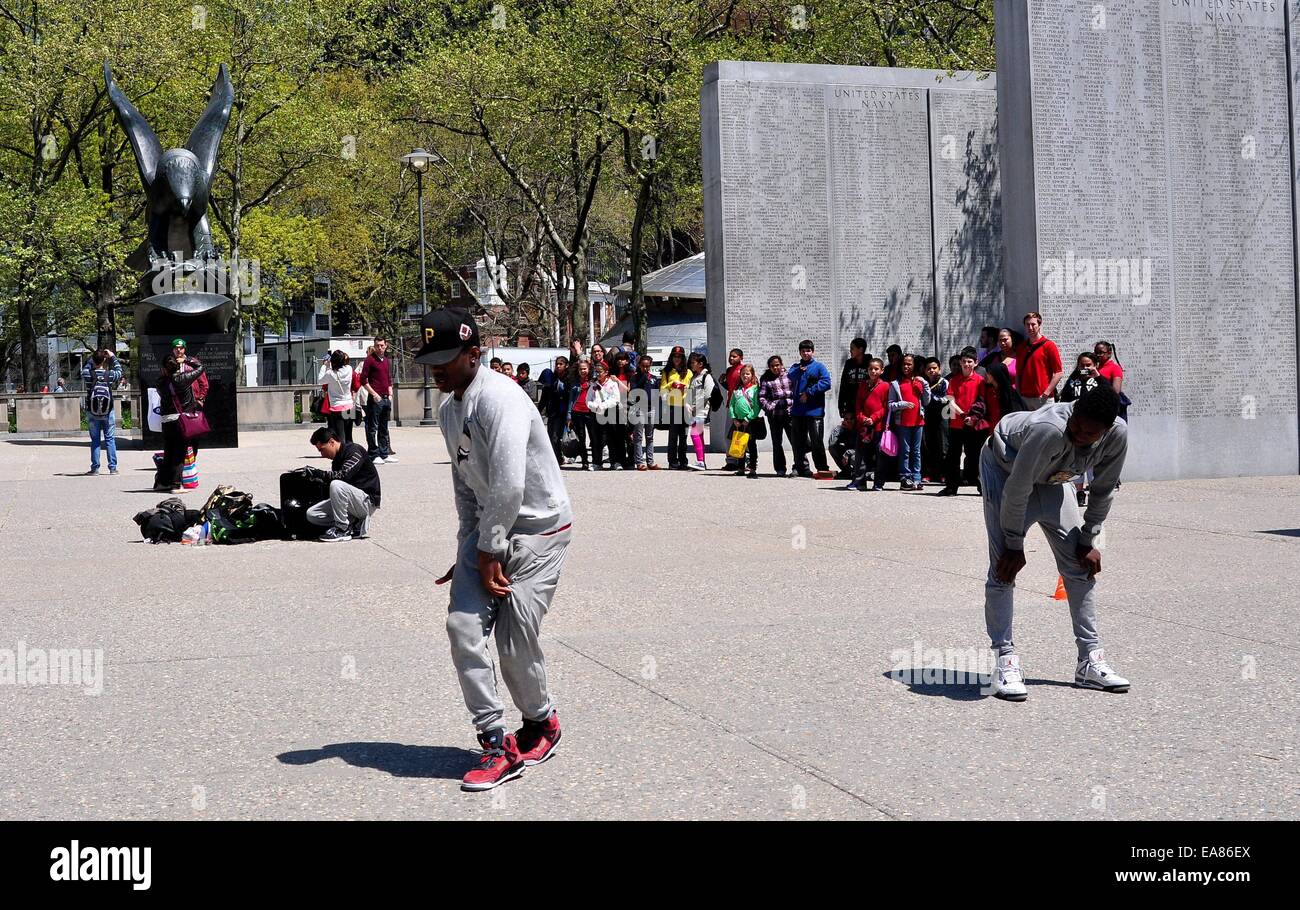 NYC: Young men performing a break dancing routine at the plaza in front ...