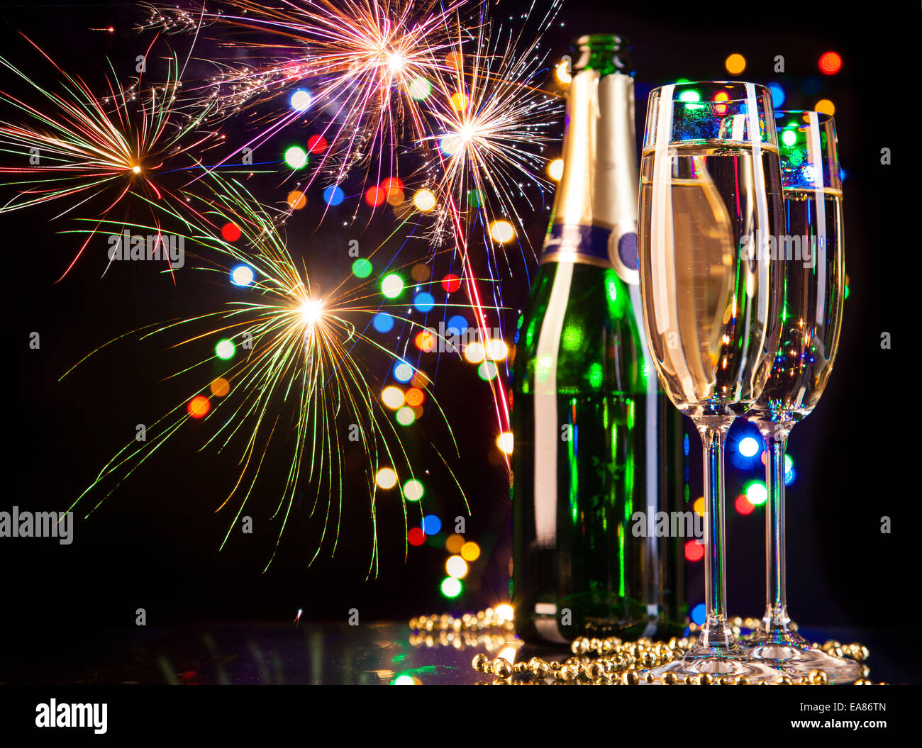 Champagne glasses with fireworks on background Stock Photo - Alamy