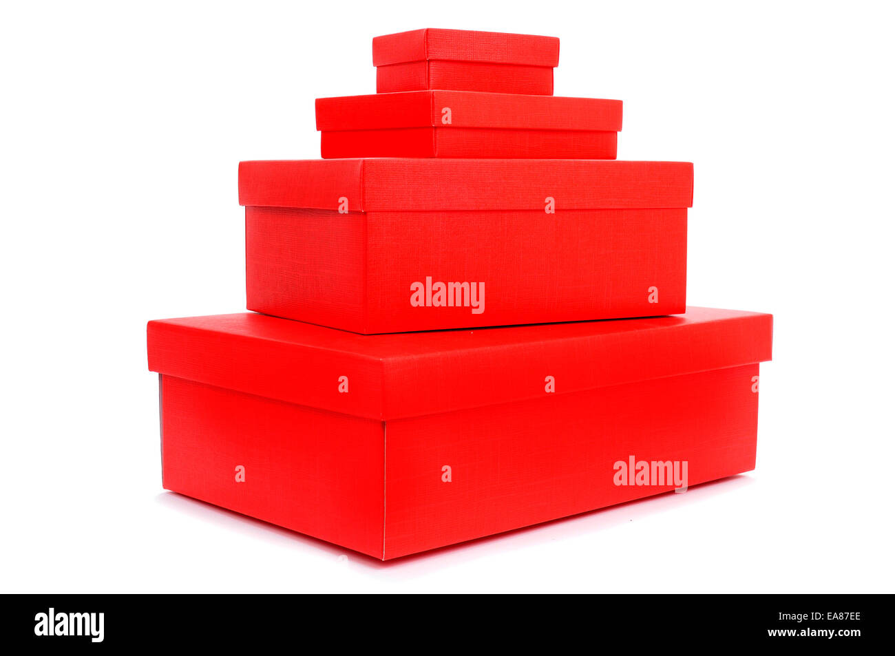 a pile of red gift boxes with different sizes on a white background ...