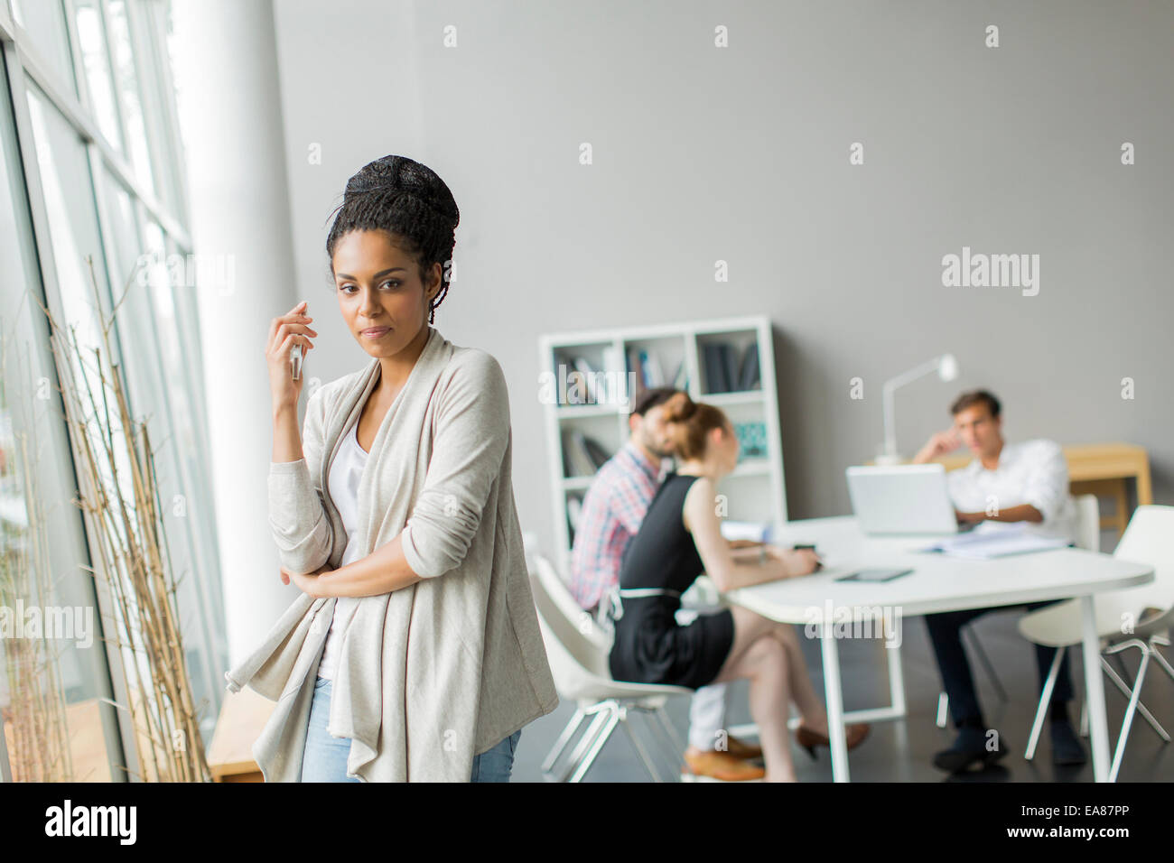 Young people in the office Stock Photo - Alamy