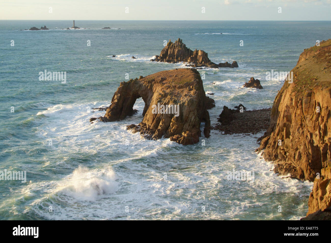 View across Zawn Wells to the Rocky Islands of Enys Dodnan and The ...