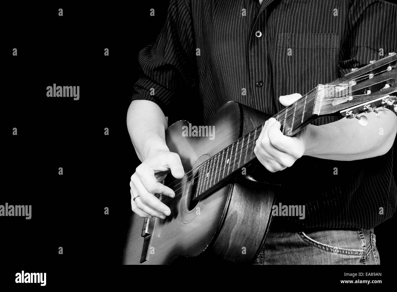 Male hand man playing guitar Black and White Stock Photos & Images - Alamy