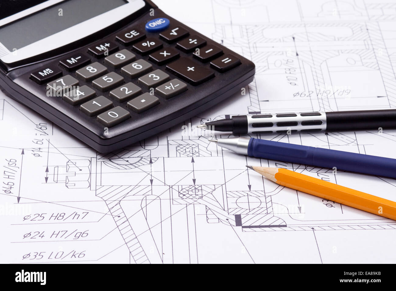 calculator and several pens on draft Stock Photo - Alamy