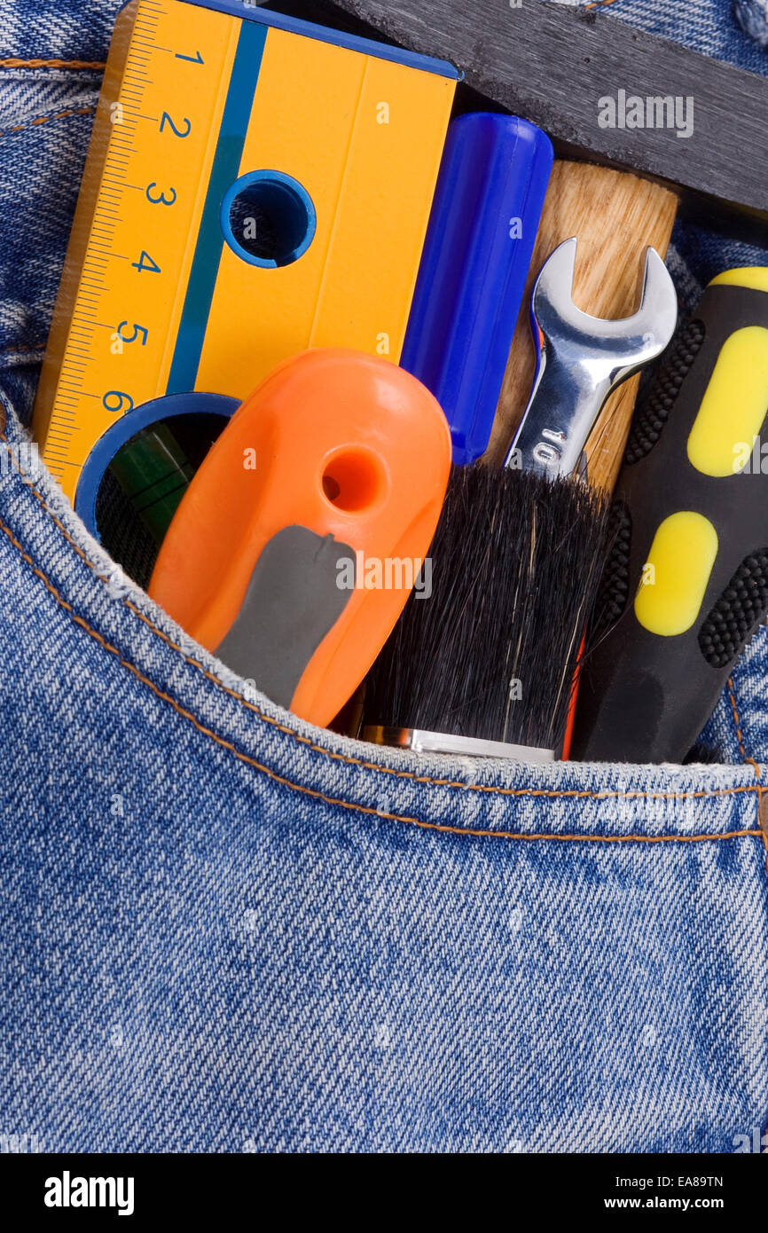 set of tools on jeans Stock Photo - Alamy