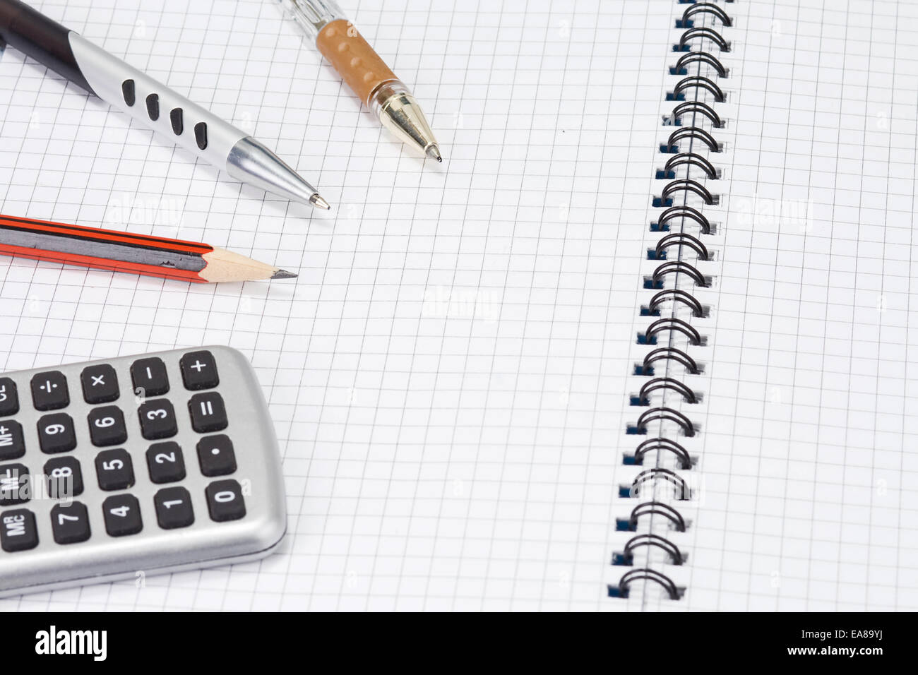 several pens and pencil on pad Stock Photo - Alamy