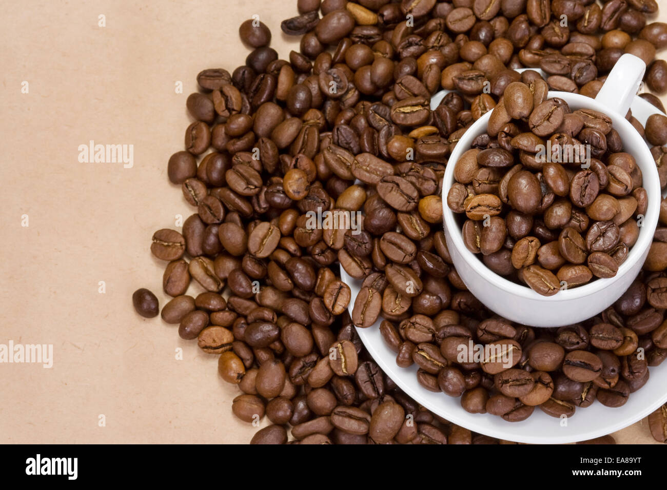 cup of coffee beans at old paper Stock Photo - Alamy