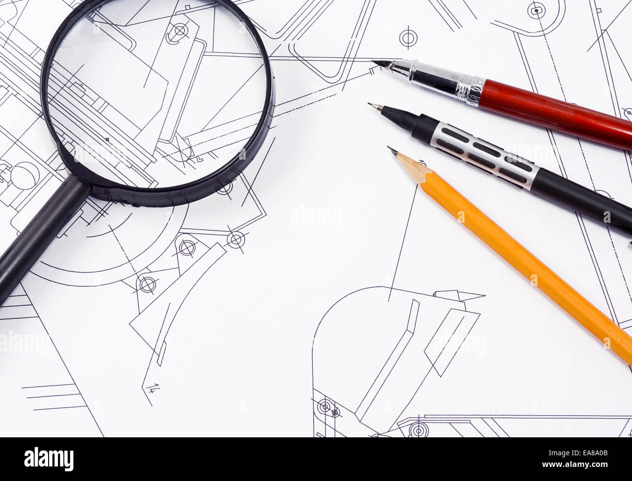 magnifying glass and pens on drafting Stock Photo - Alamy
