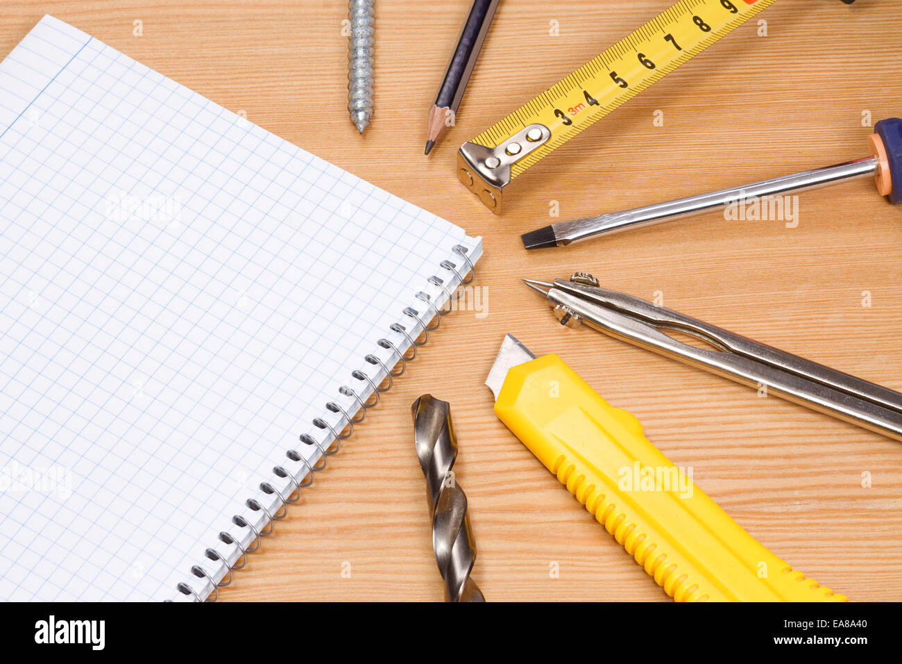 note pad and tools on table Stock Photo - Alamy