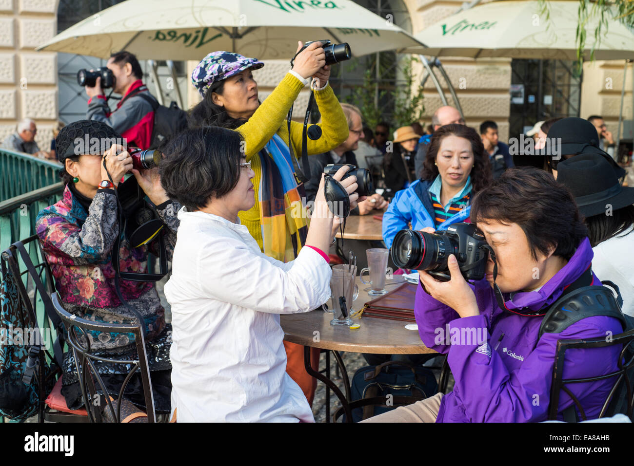 Asian Tourists With Cameras