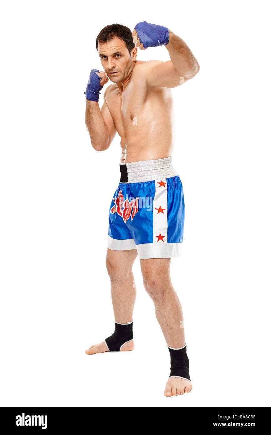 Caucasian kickboxer or muay thai fighter executing a punch, isolated on ...