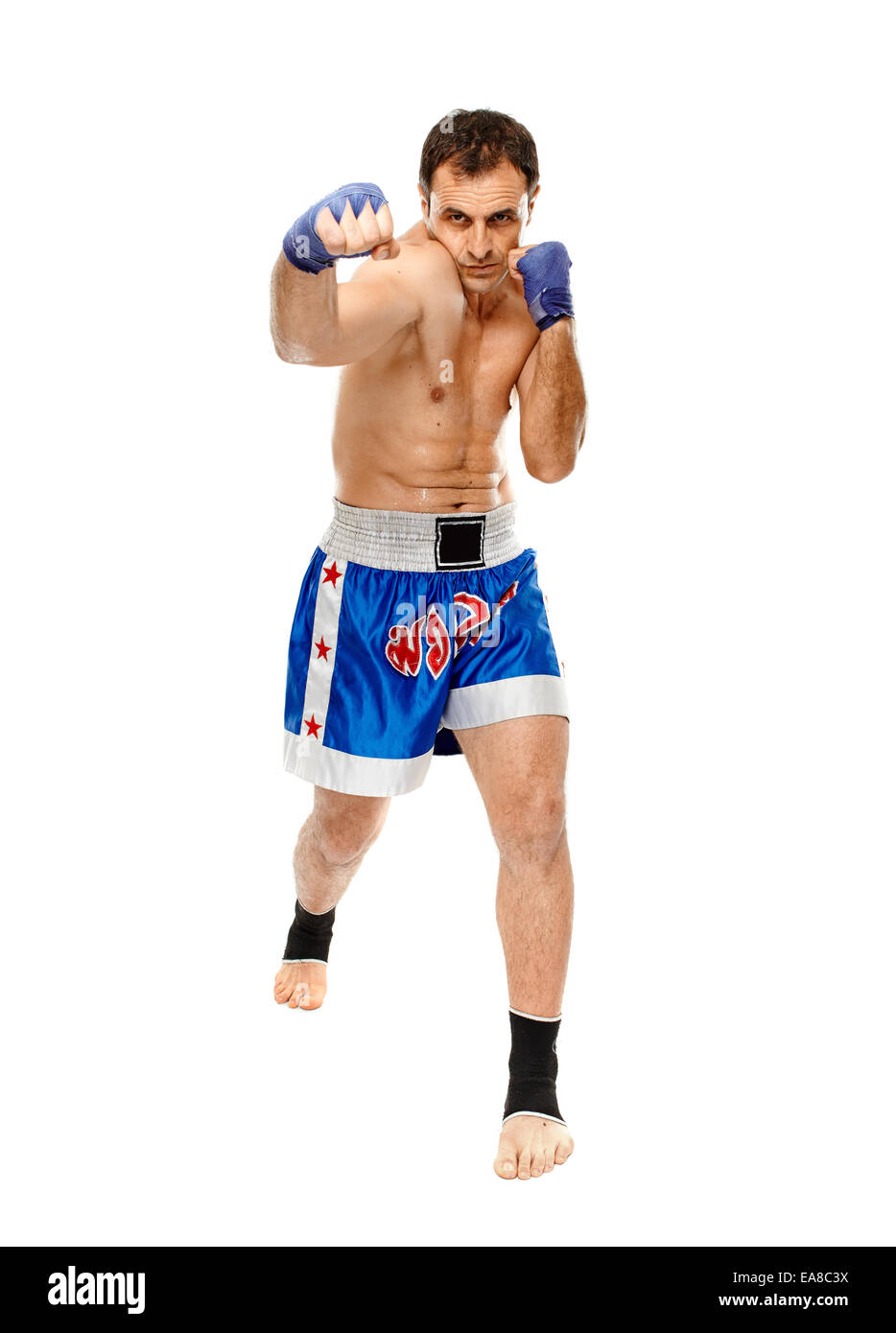 Caucasian kickboxer or muay thai fighter executing a punch, isolated on ...