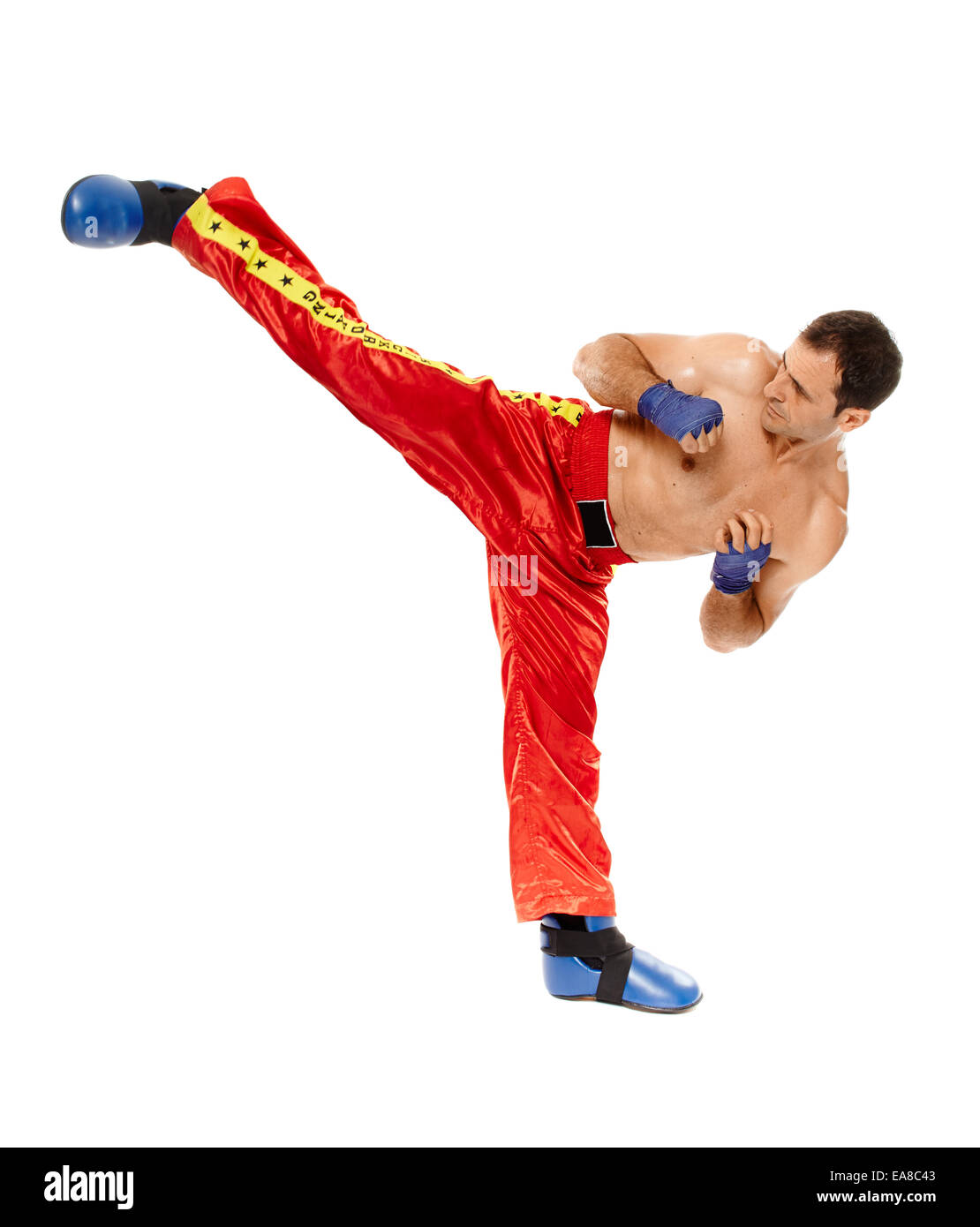 Muay thai or kickboxer executing a powerful kick, isolated on white ...