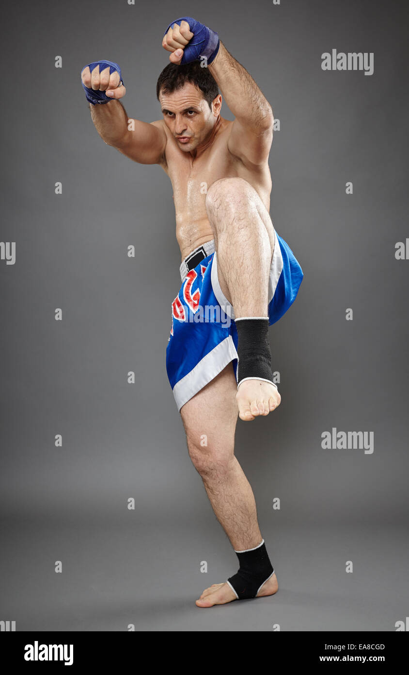 Muay thai or kickboxer executing a powerful kick Stock Photo - Alamy