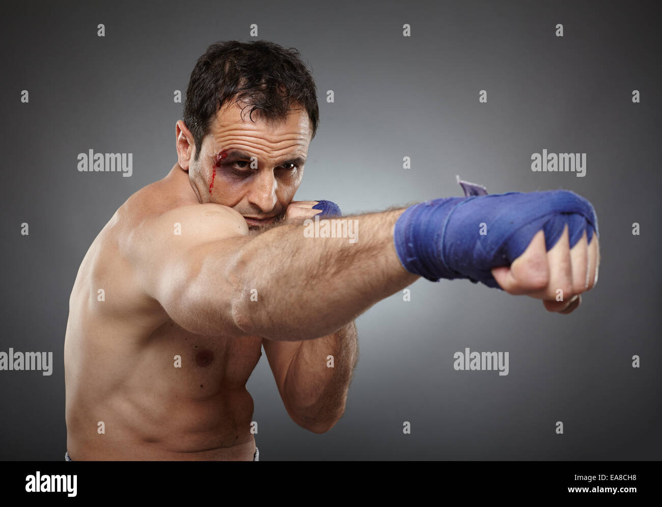 Muay thai or kickbox fighter with bruises and blood on his face ...