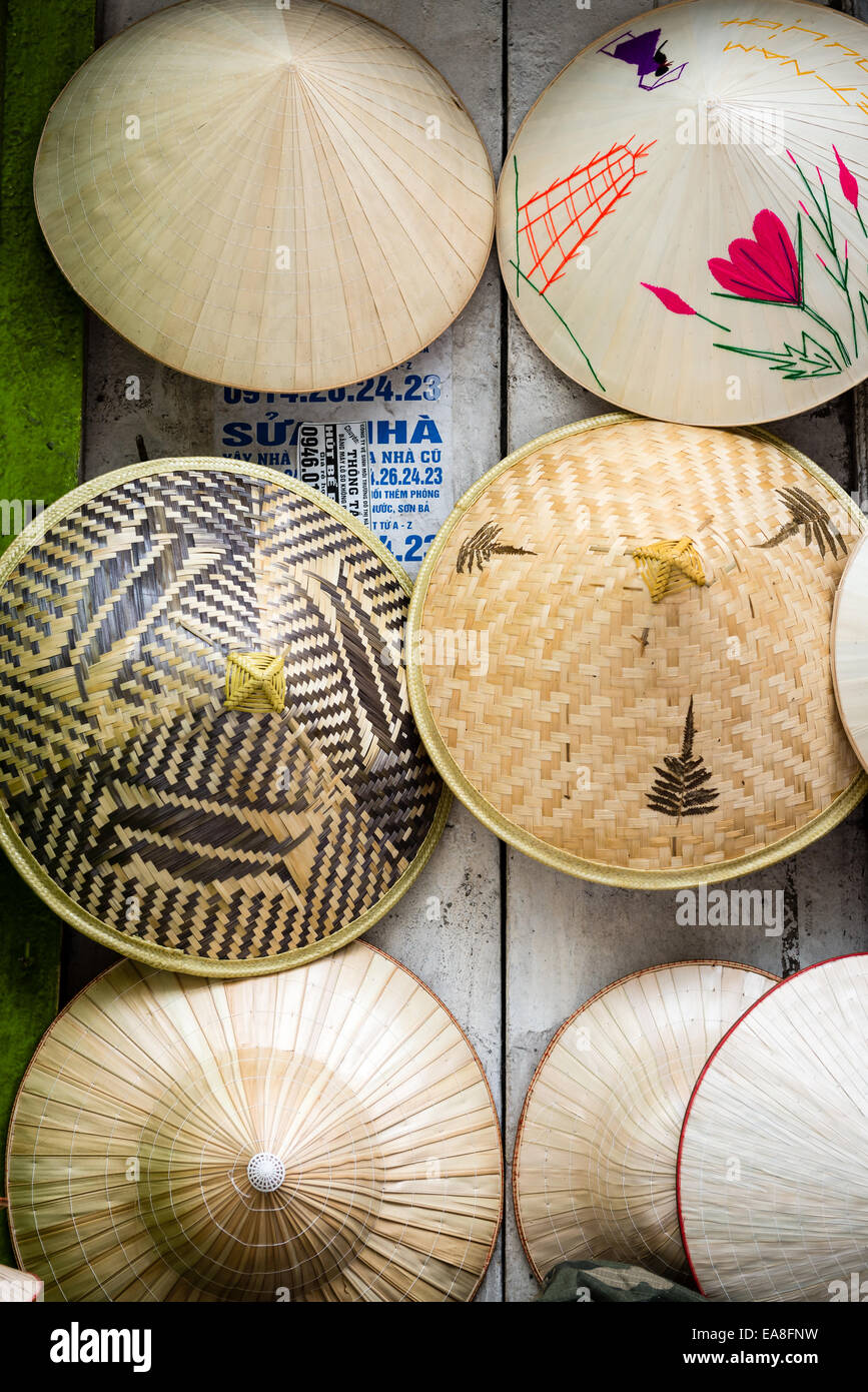 Traditional Vietnamese conical hats hanging on a wall Stock Photo - Alamy