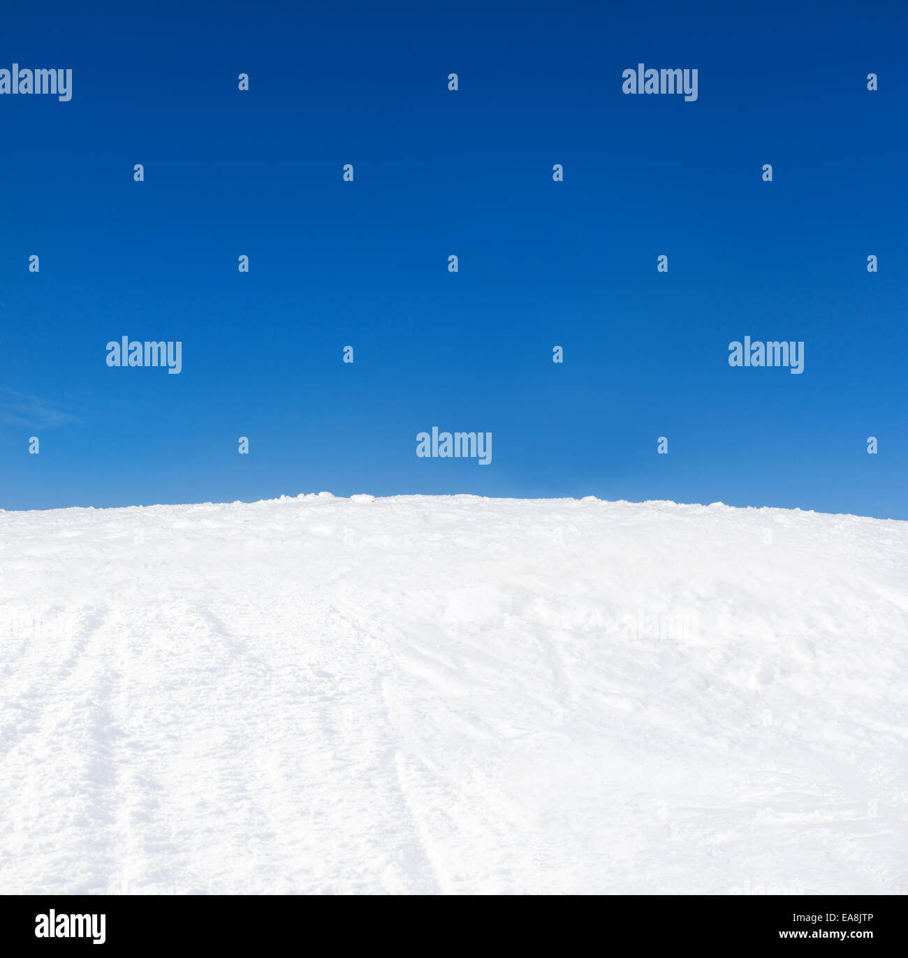 Winter mountains snow slope and blue sky Stock Photo - Alamy