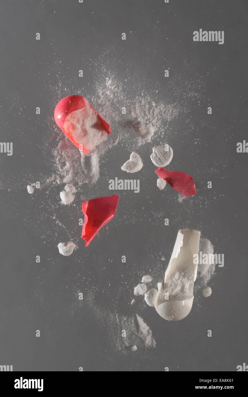 Pain relief contents of broken drug capsule scattered out revealing ...