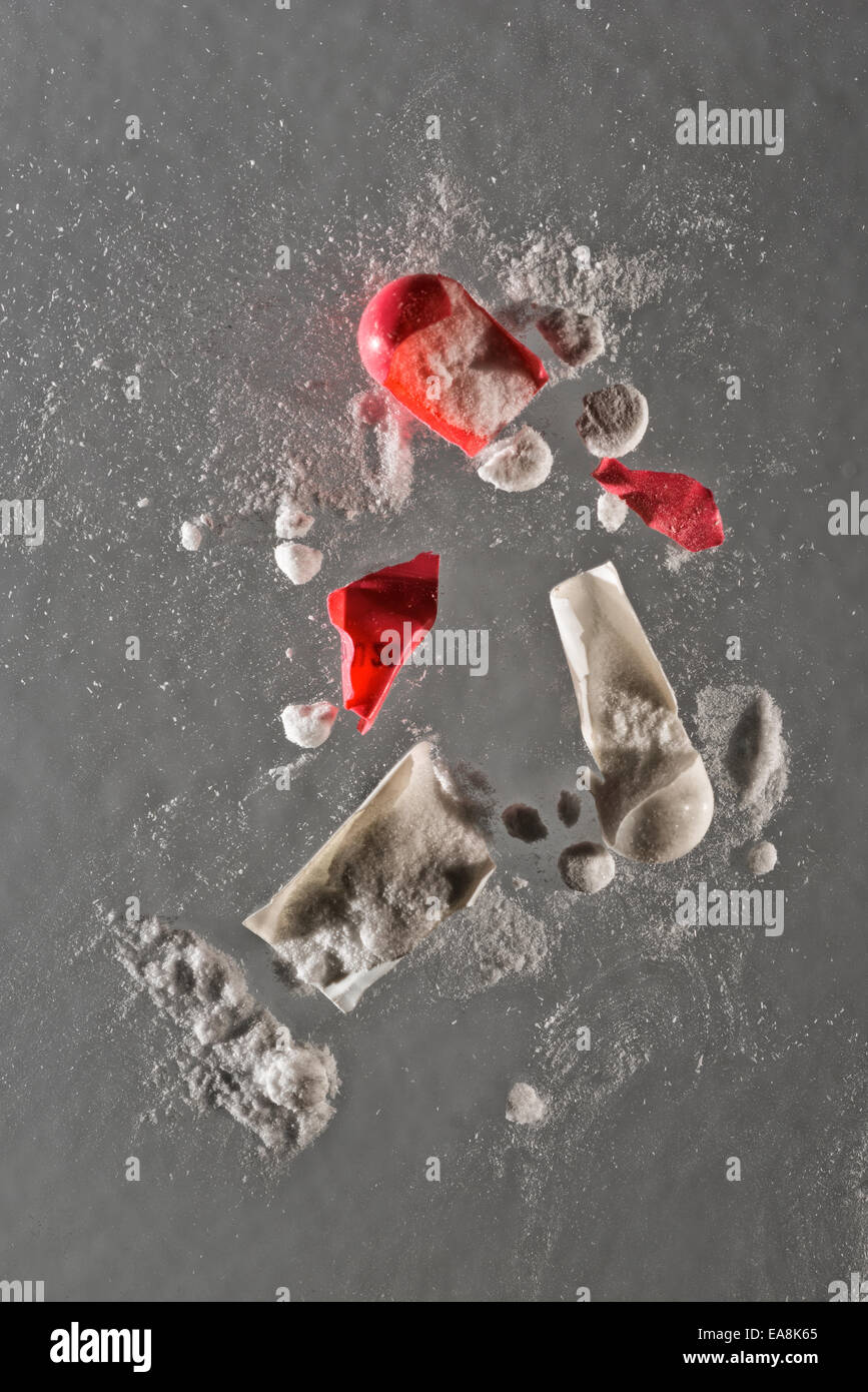 Pain relief contents of broken drug capsule scattered out revealing ...