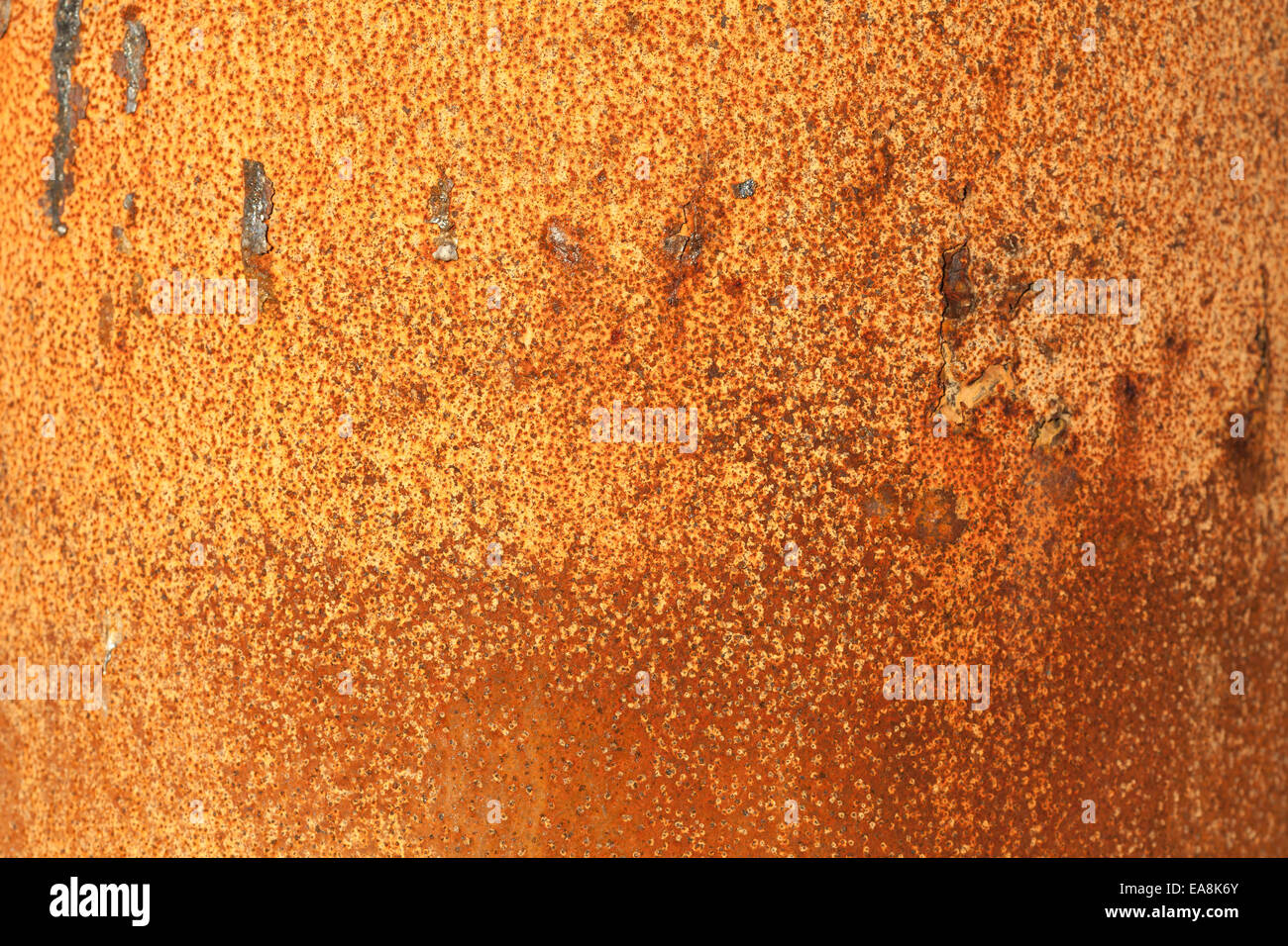 Rusty orange piece of metal. Ideal as a background texture Stock Photo ...
