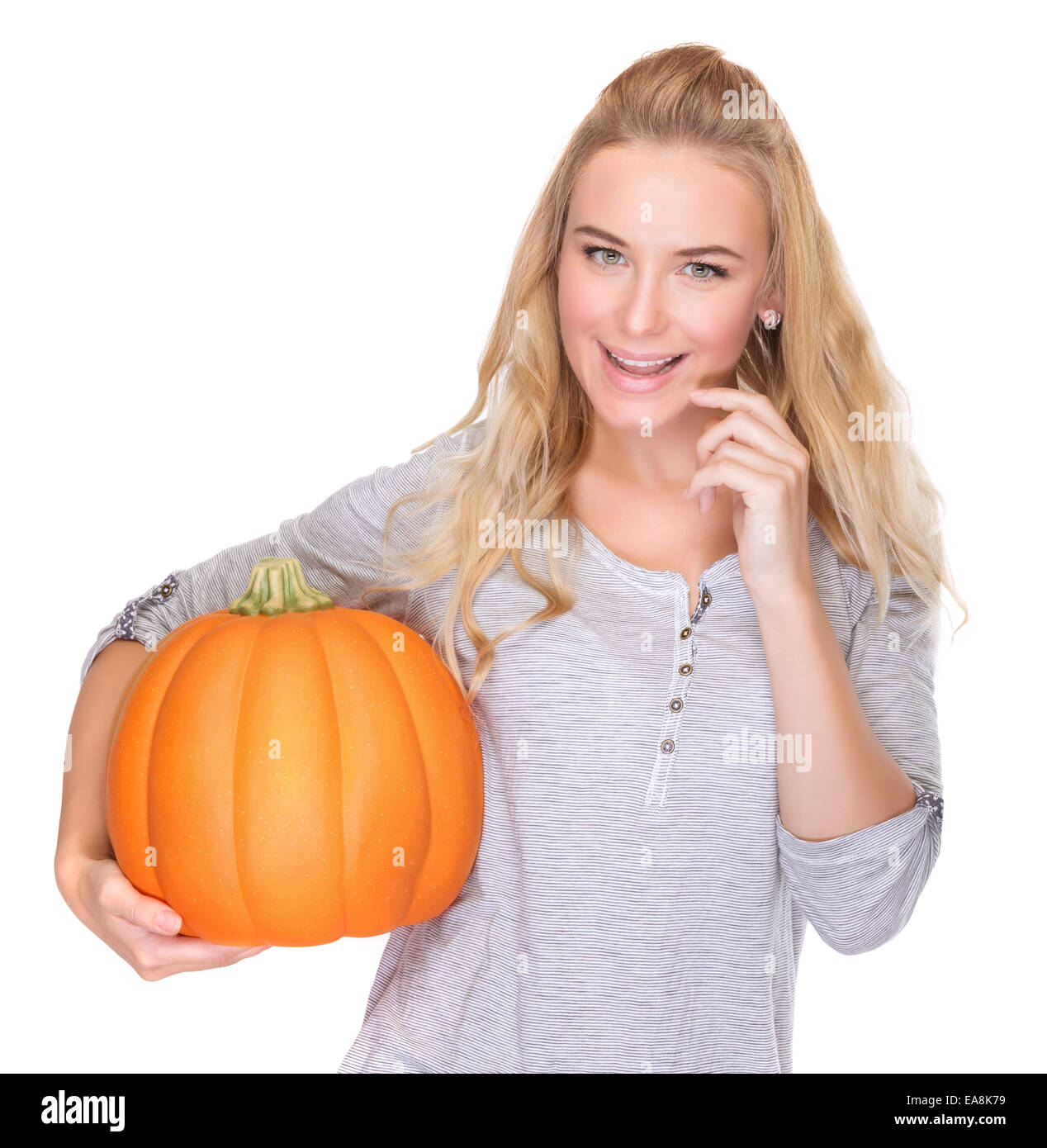 Portrait of happy woman with big ripe Thanksgiving pumpkin isolated on ...