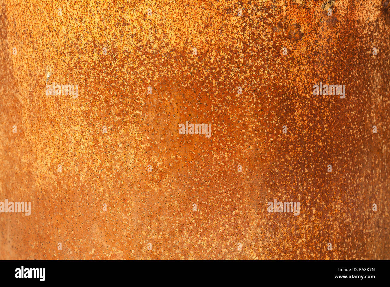 Rusty orange piece of metal. Ideal as a background texture Stock Photo ...