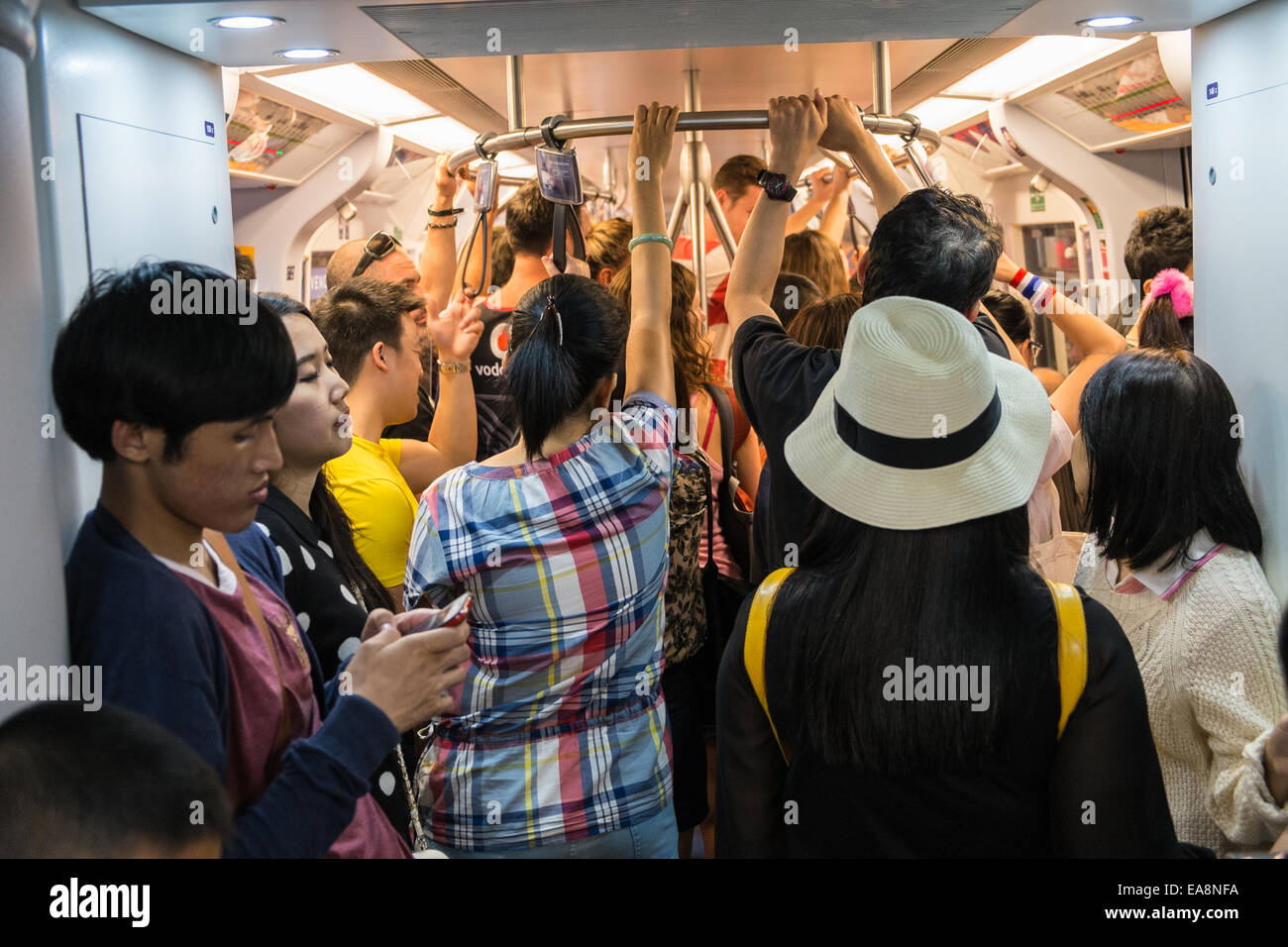 Commute,BTS,train,skytrain,interior,using mobile phone, Bangkok ...