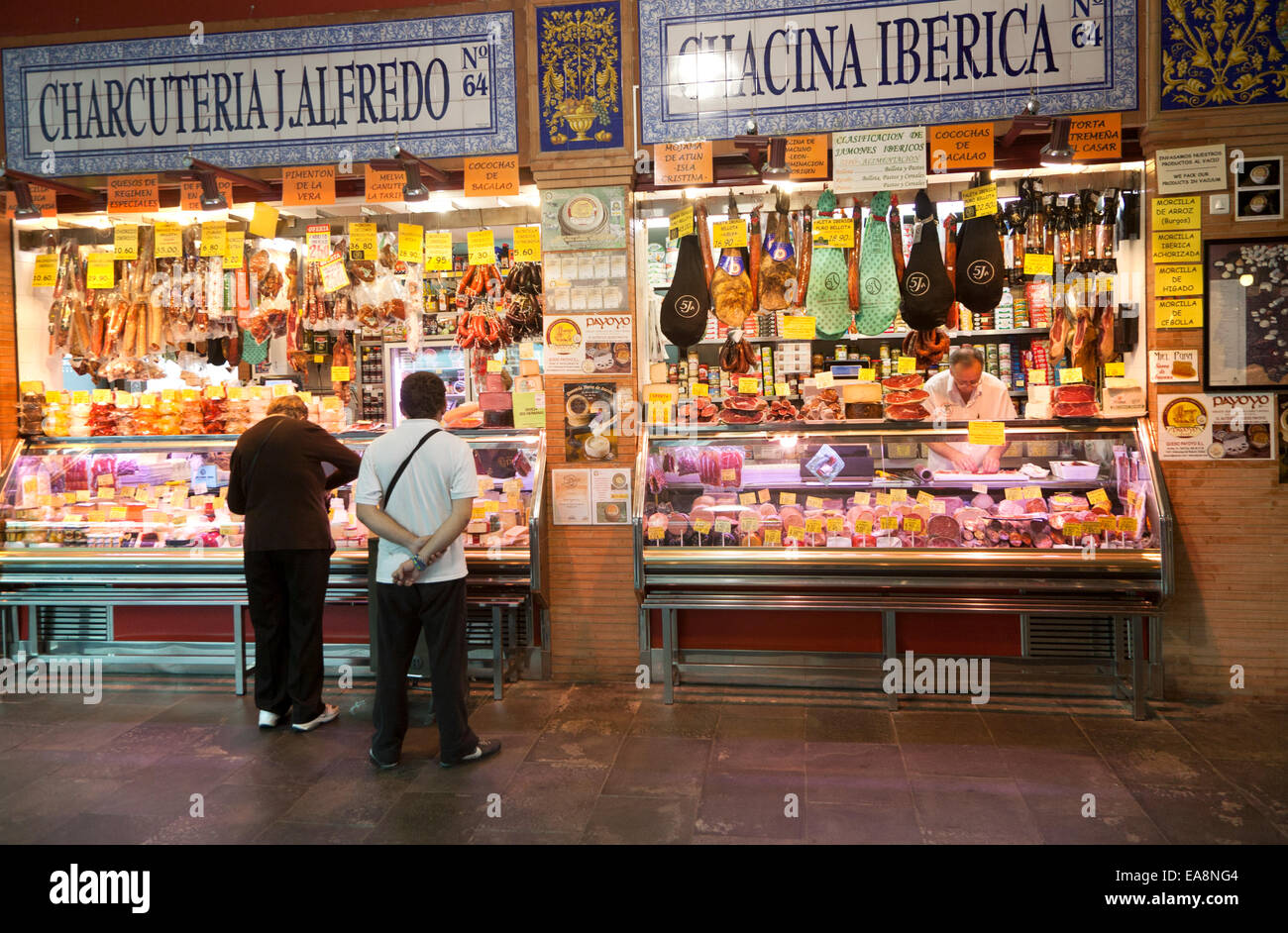 Butcher's stall in historic market building in Triana, Seville, Spain ...