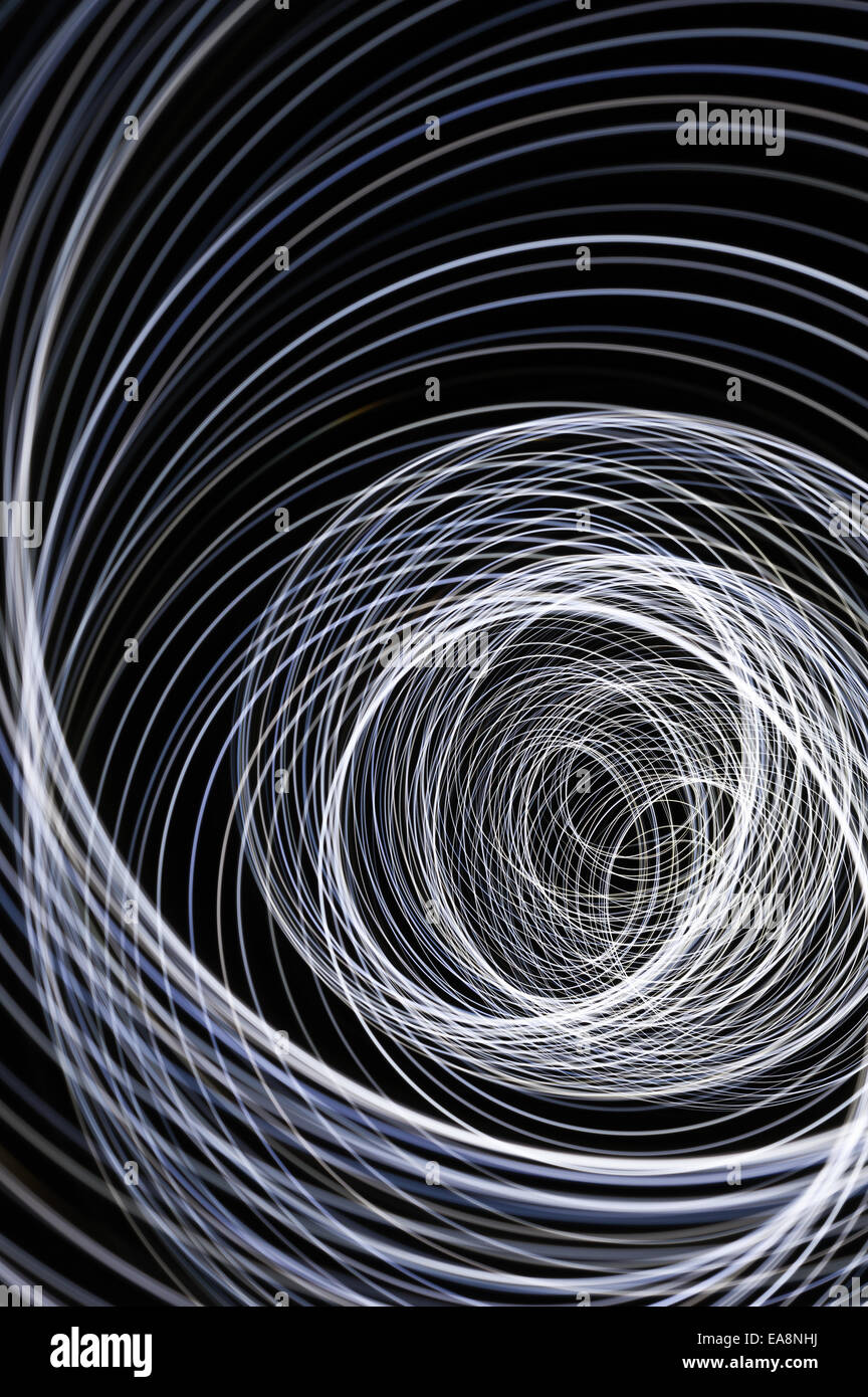 swirling spinning motion and trails traces of moving lights creating ...