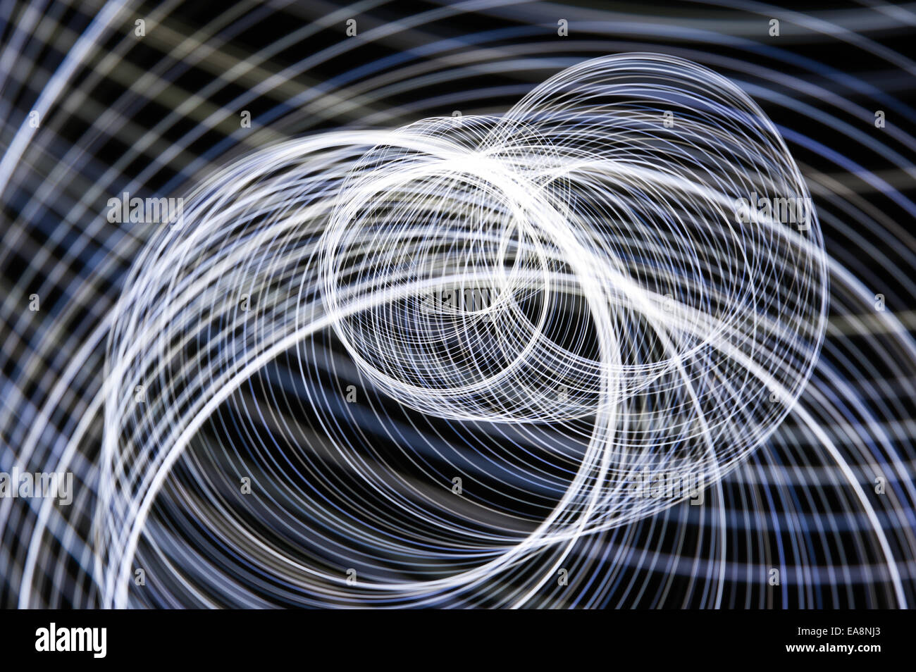 swirling spinning motion and trails traces of moving lights creating ...