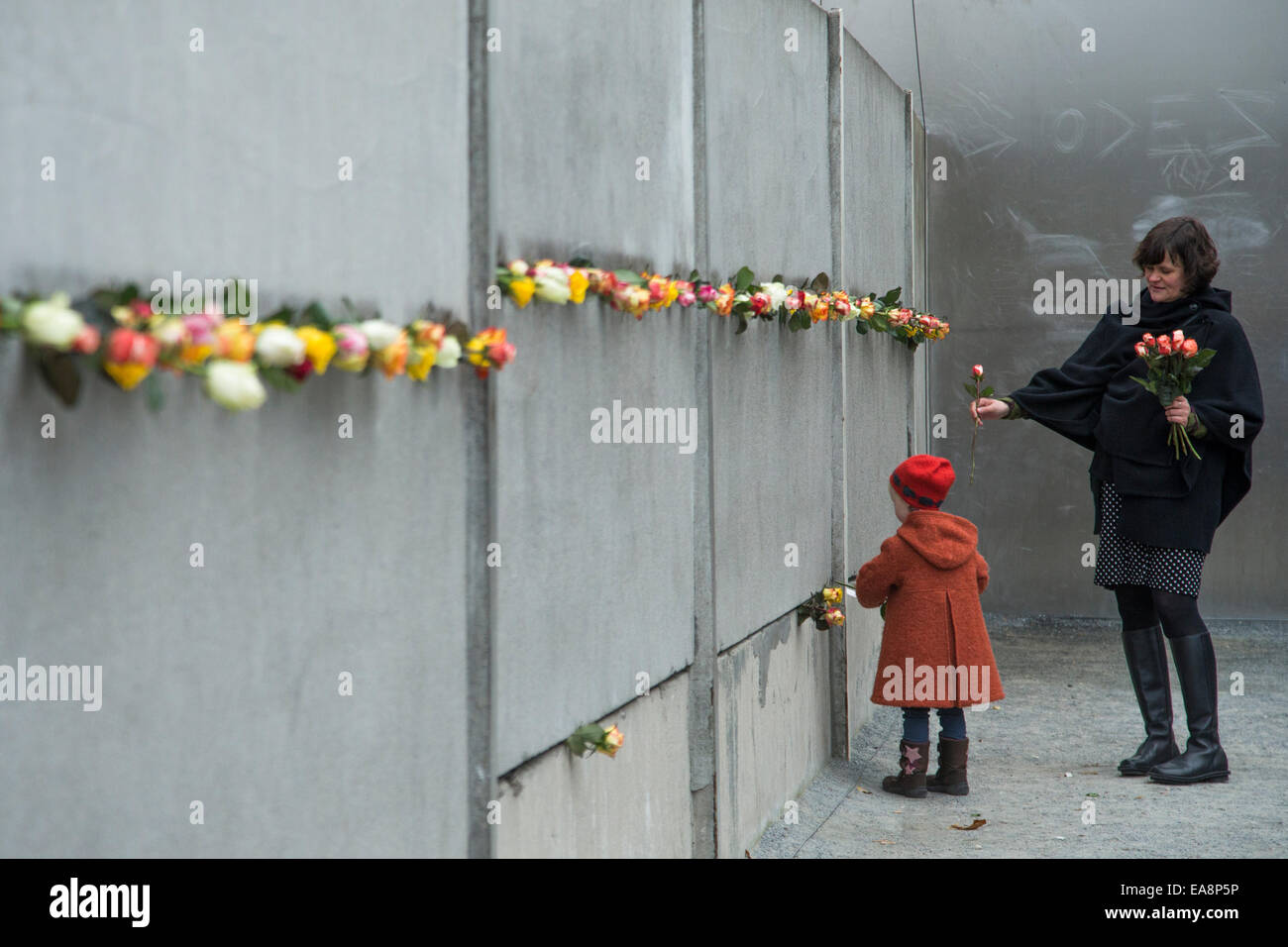 The little Rüder laying roses at Berlin Wall Memorial at the 25th ...