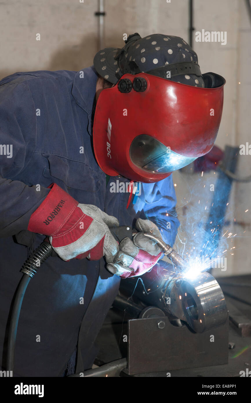 Engineer welding a metal part Stock Photo - Alamy