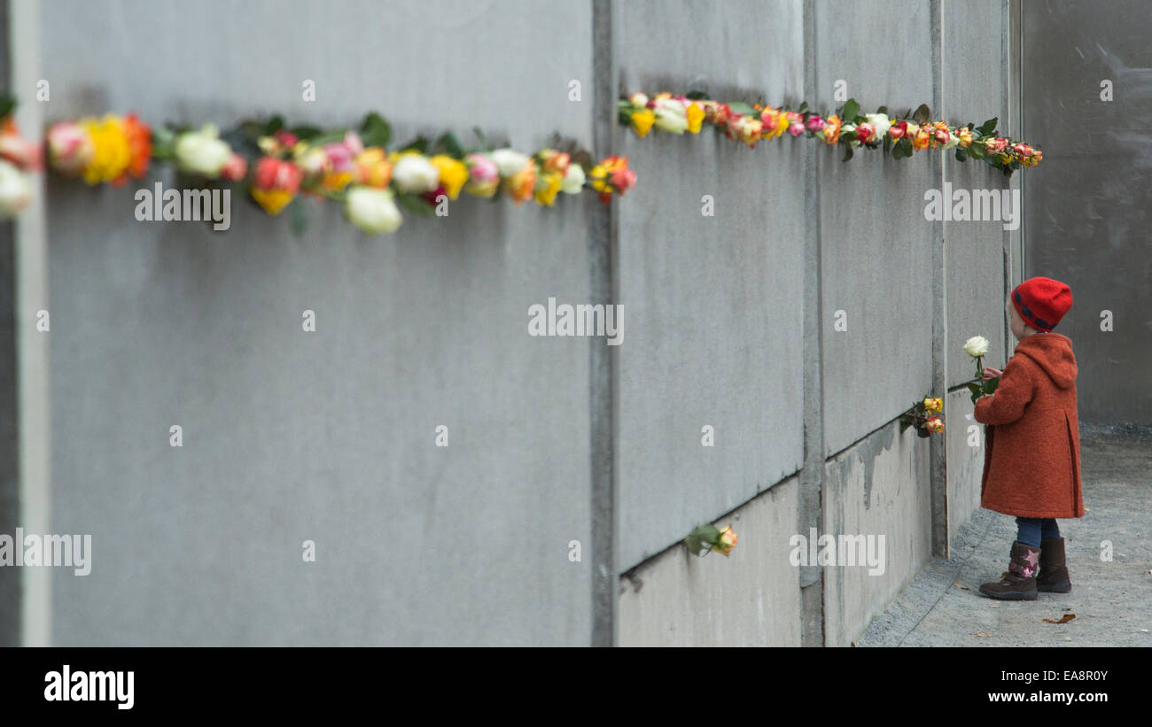 The little Rüder laying roses at Berlin Wall Memorial at the 25th ...