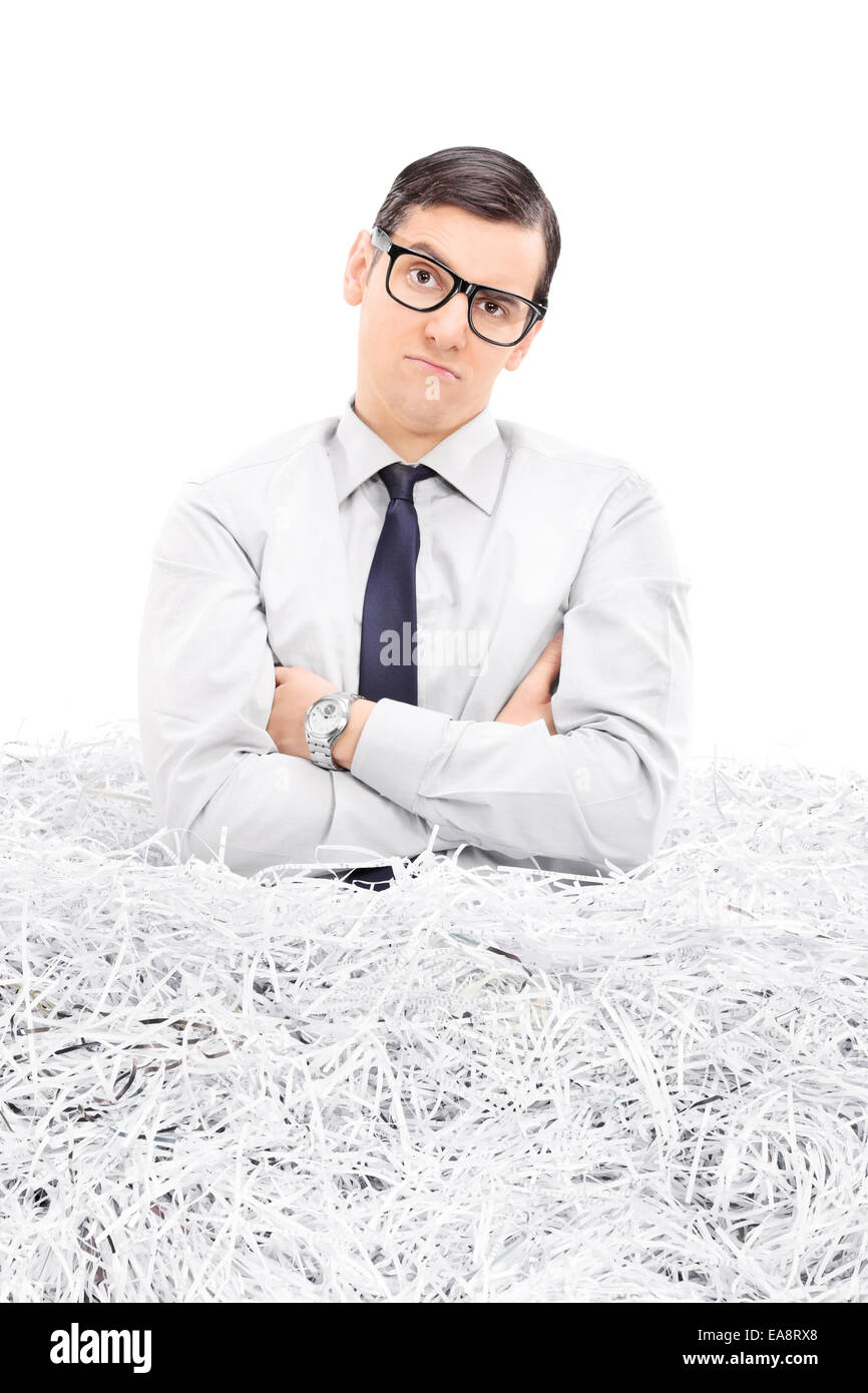 Sad man in a pile of shredded paper isolated on white background Stock ...