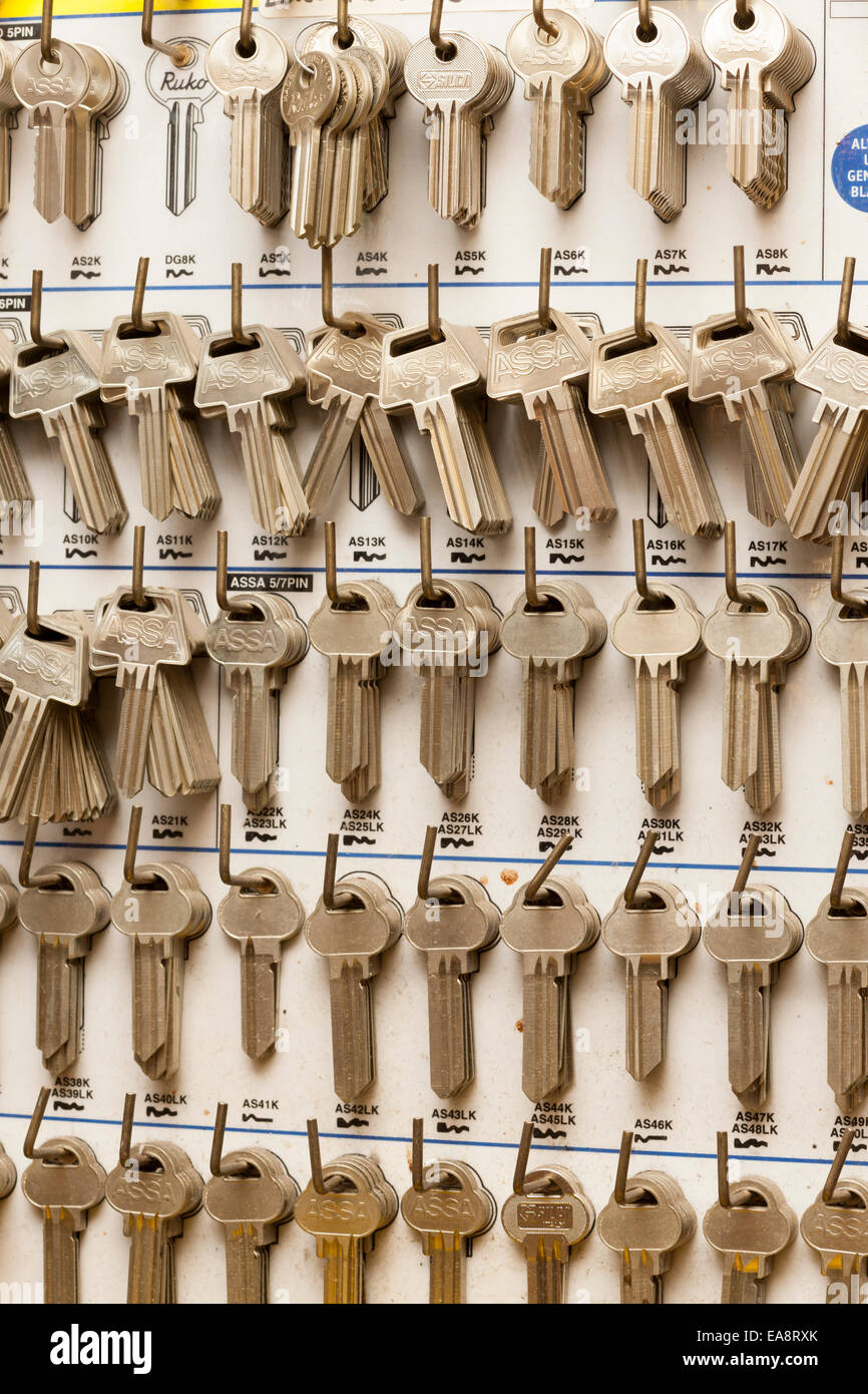 Blank keys hanging in a locksmith's shop Stock Photo - Alamy