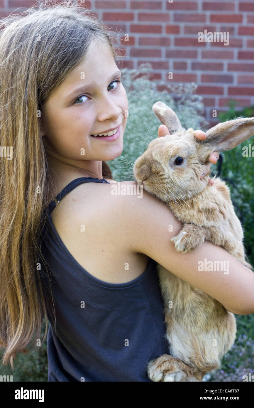 Young girl with rabbit Stock Photo - Alamy