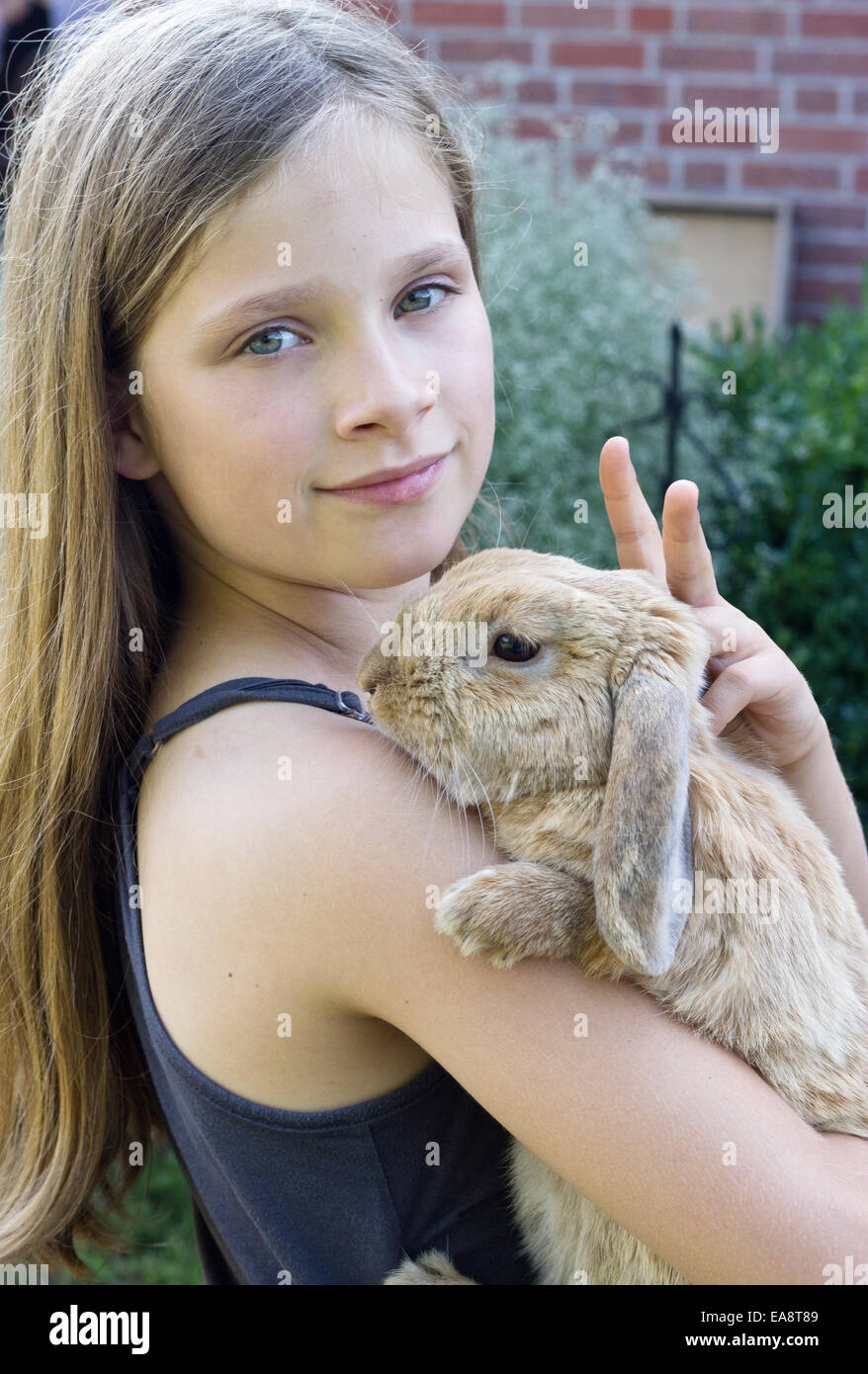 Young girl with rabbit Stock Photo - Alamy