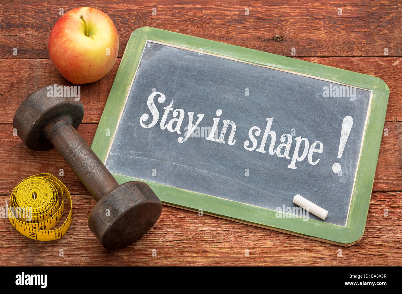 stay in shape concept - slate blackboard sign against weathered red ...