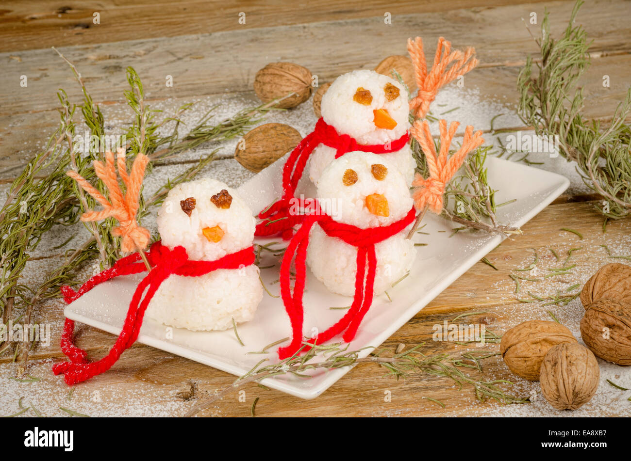 Funny rice snowmen, a kid meal for Christmas Stock Photo - Alamy