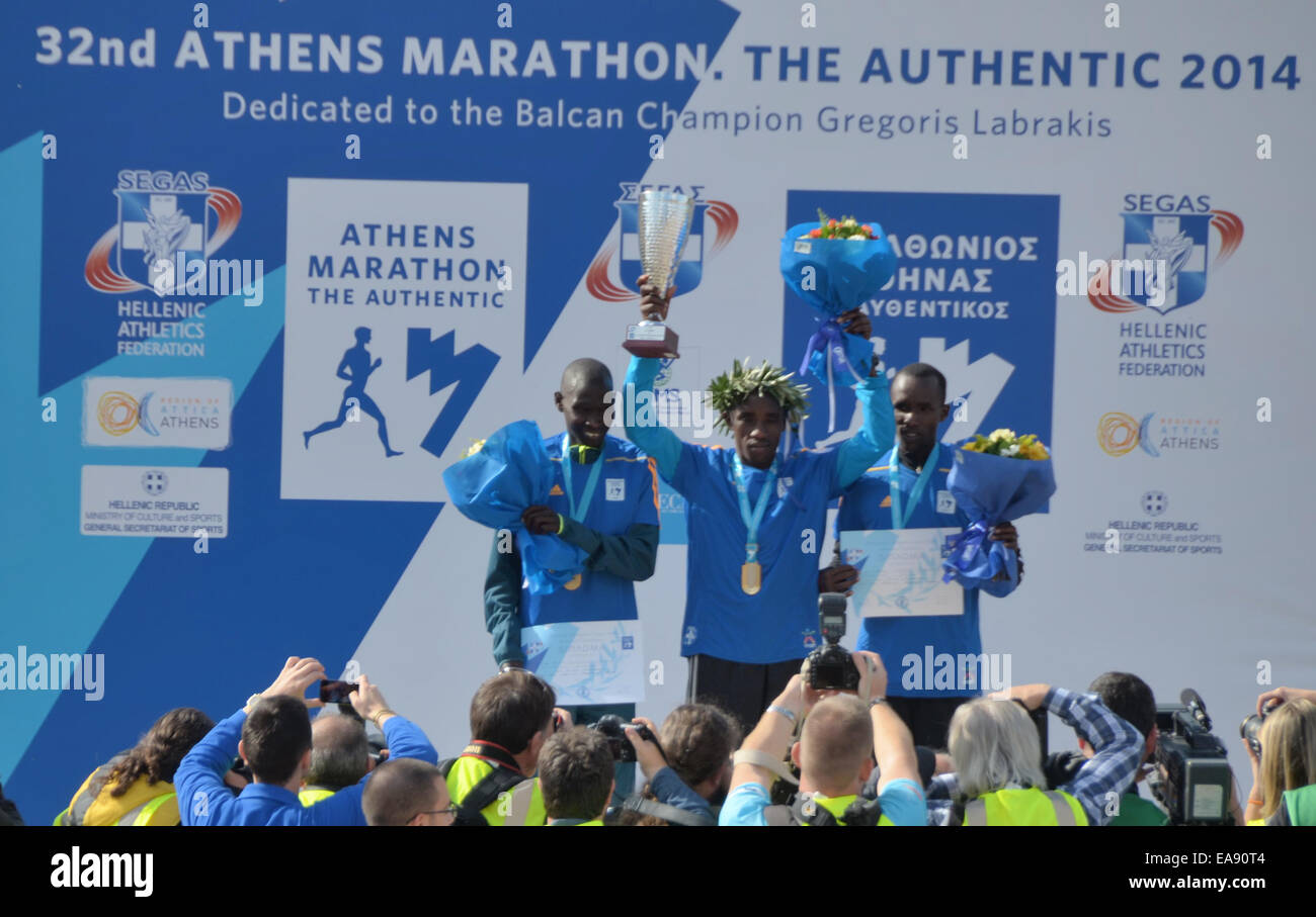 The 3 First runners to complete the Marathon pose with their awards ...