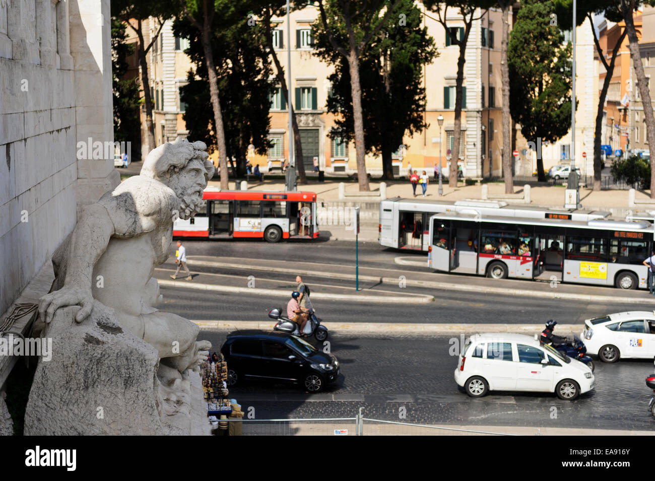 Commuters on buses, cars and bikers on the busy road in the City of ...