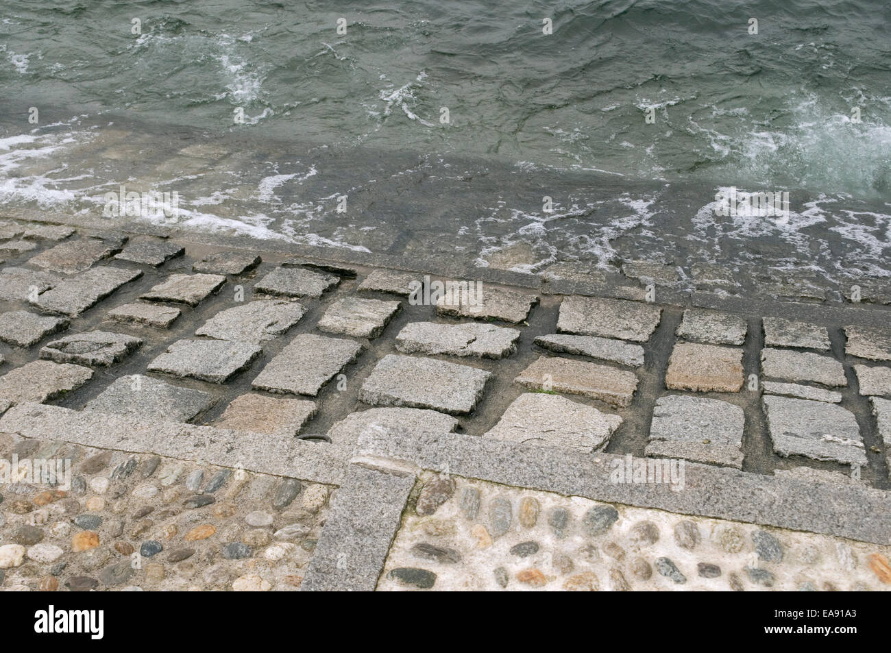 Lakeshore riprap stones Stock Photo - Alamy