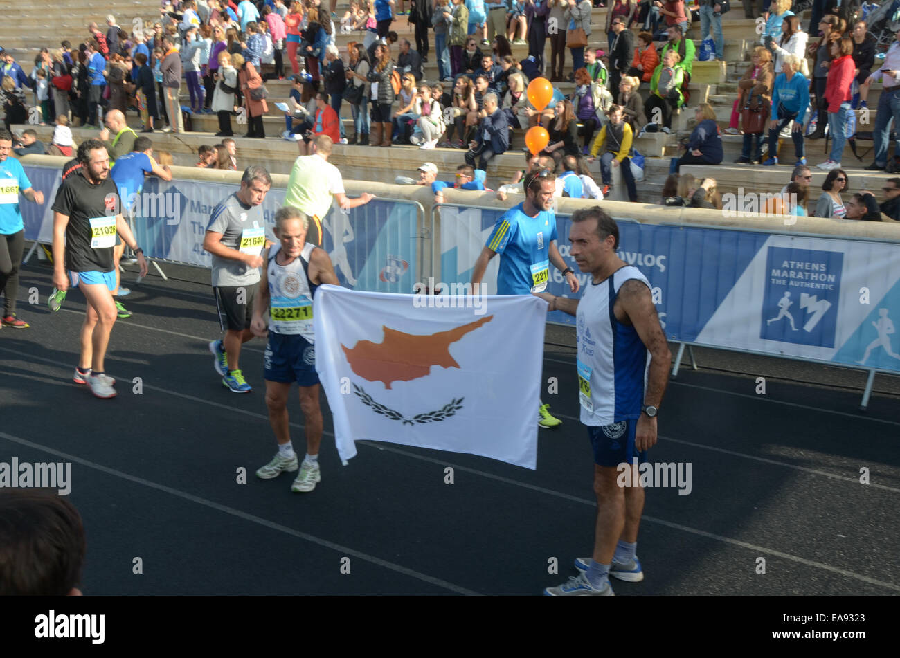 Athens, Greece. 9th Nov, 2014. Runners hold the flag of Cyprus.Races of ...