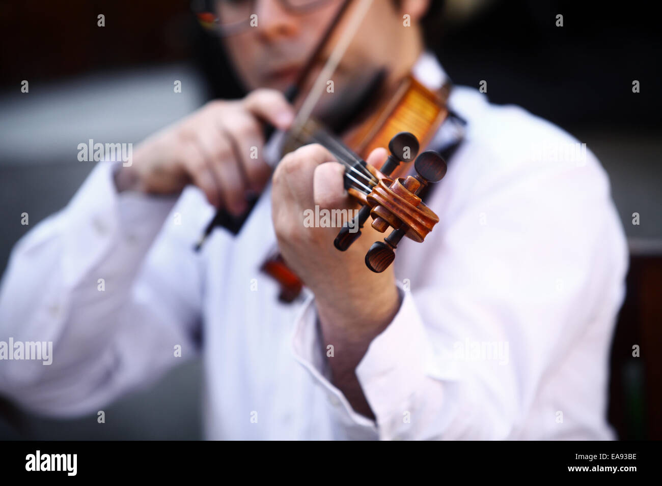 Detail of violin being played by a musician Stock Photo - Alamy