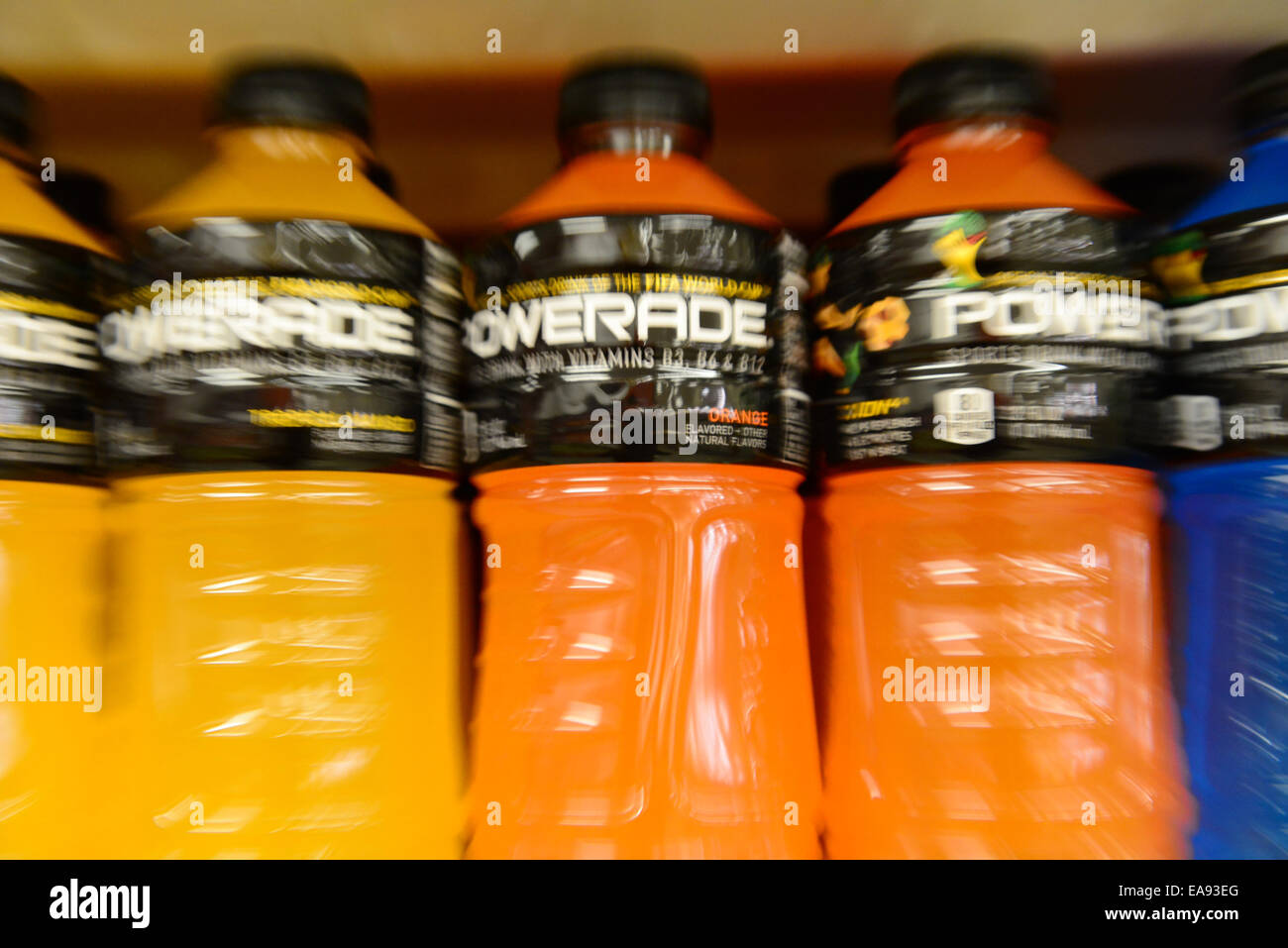 Various flavors of Powerade sports drink sit on a shelf in a store on ...